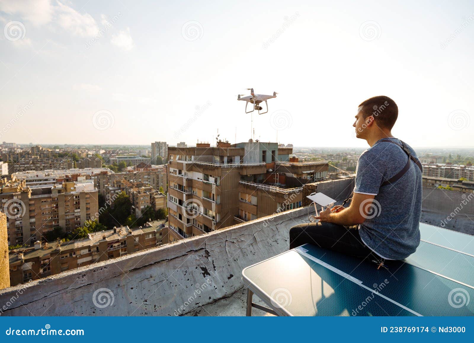 Man Operating a Drone with Remote Control on Rooftop Stock Photo ...