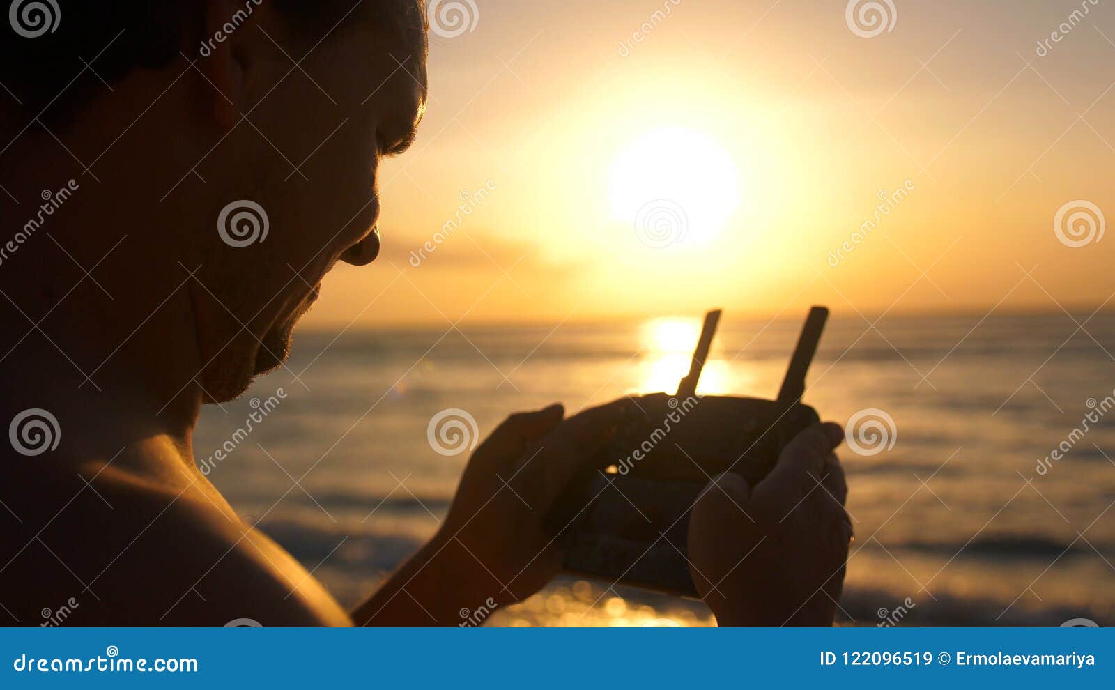 Man Operating a Drone with Remote Control. Quadro Copter Drone Flying ...