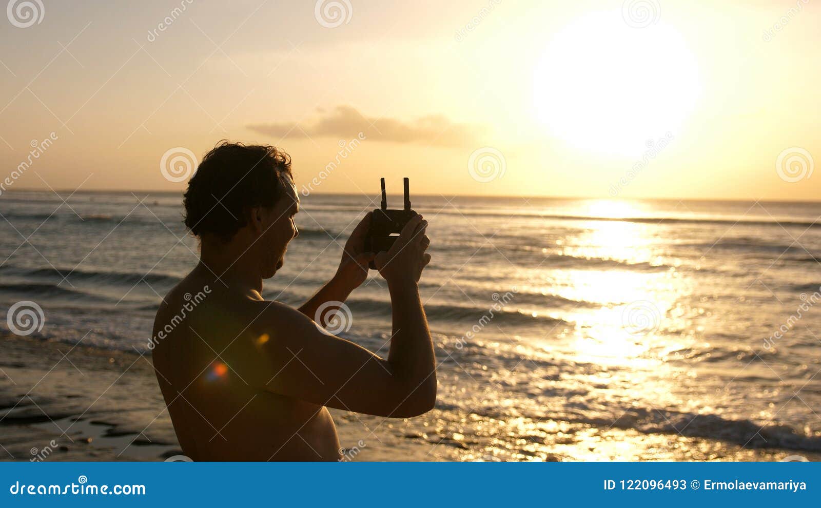 Man Operating a Drone with Remote Control. Quadro Copter Drone Flying ...
