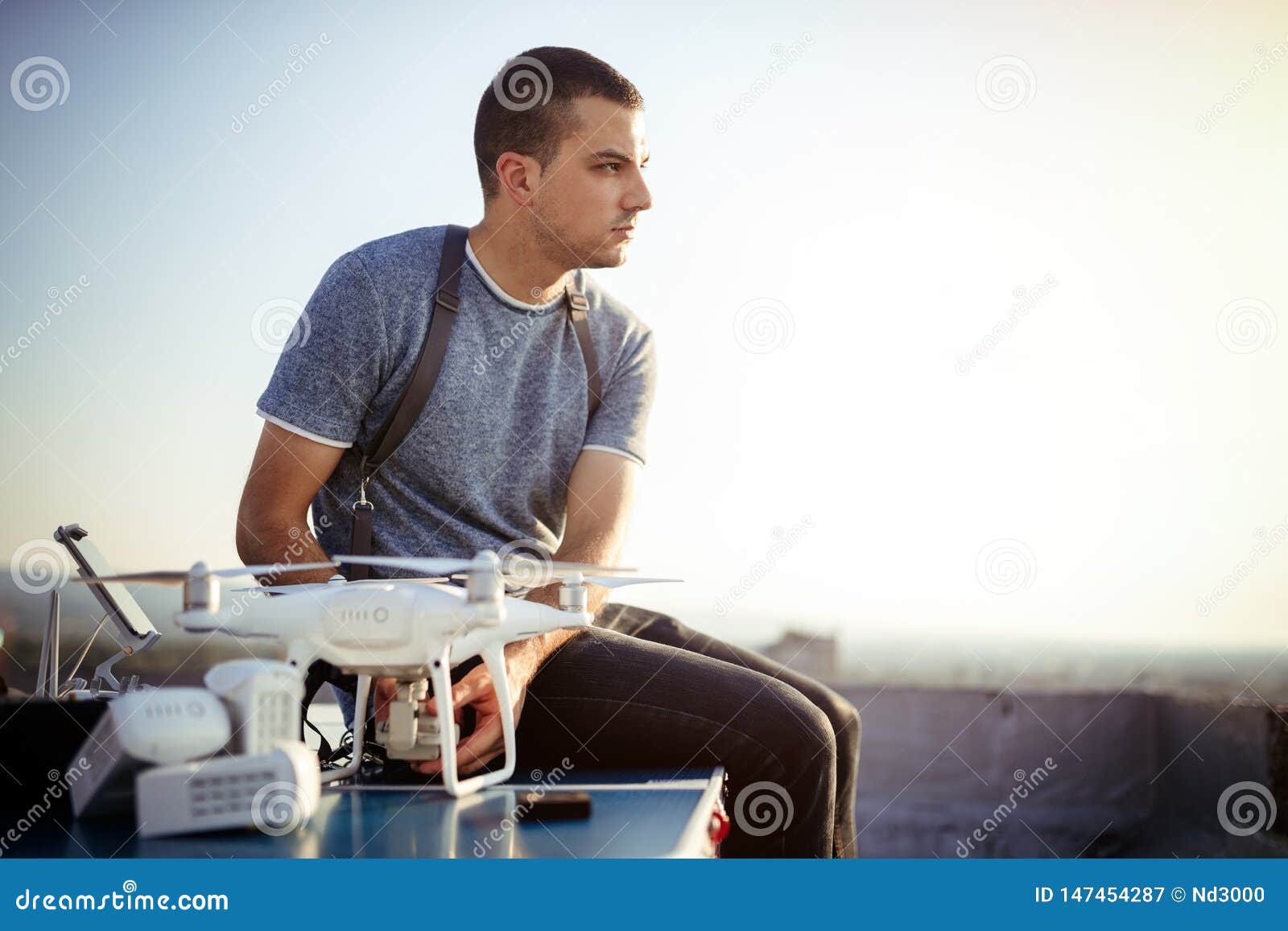 Man Operating a Drone with Remote Control on Rooftop Stock Image ...