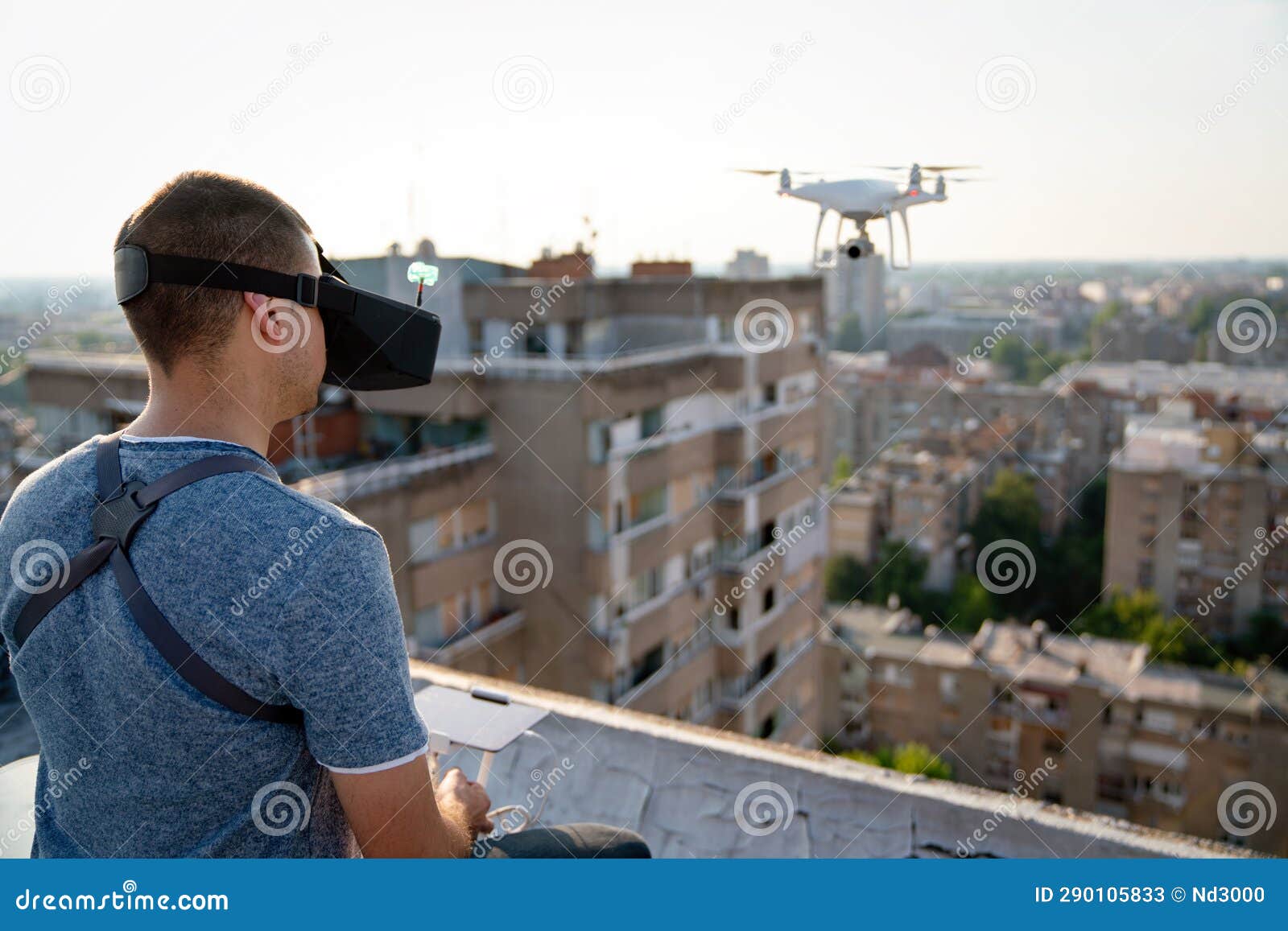 Man Operating a Drone with Remote Control on Rooftop Stock Image ...