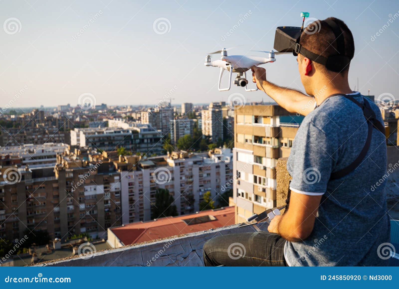 Man Operating a Drone with Remote Control on Rooftop Stock Photo ...