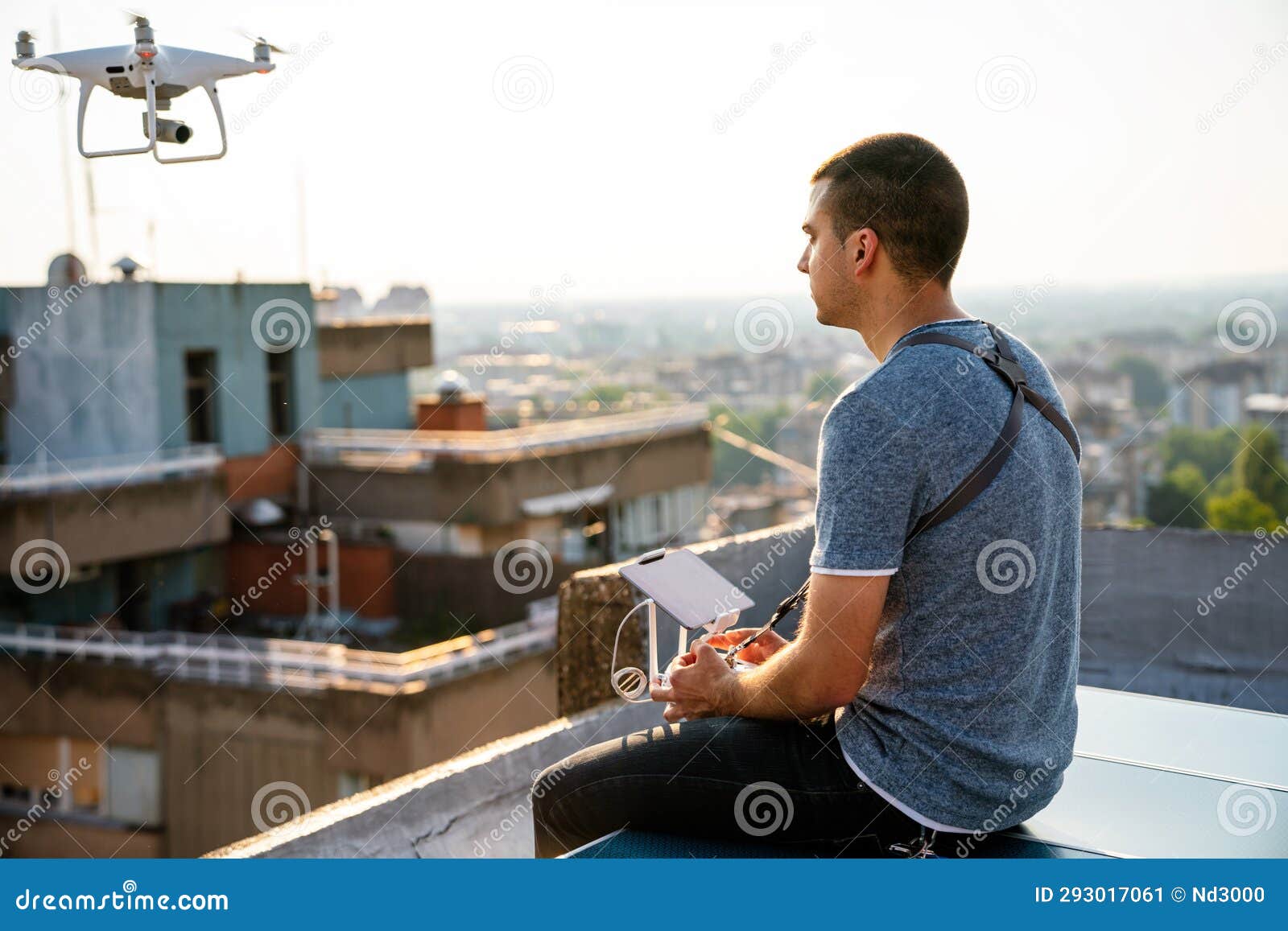 Man Operating a Drone with Remote Control on Rooftop Stock Image ...