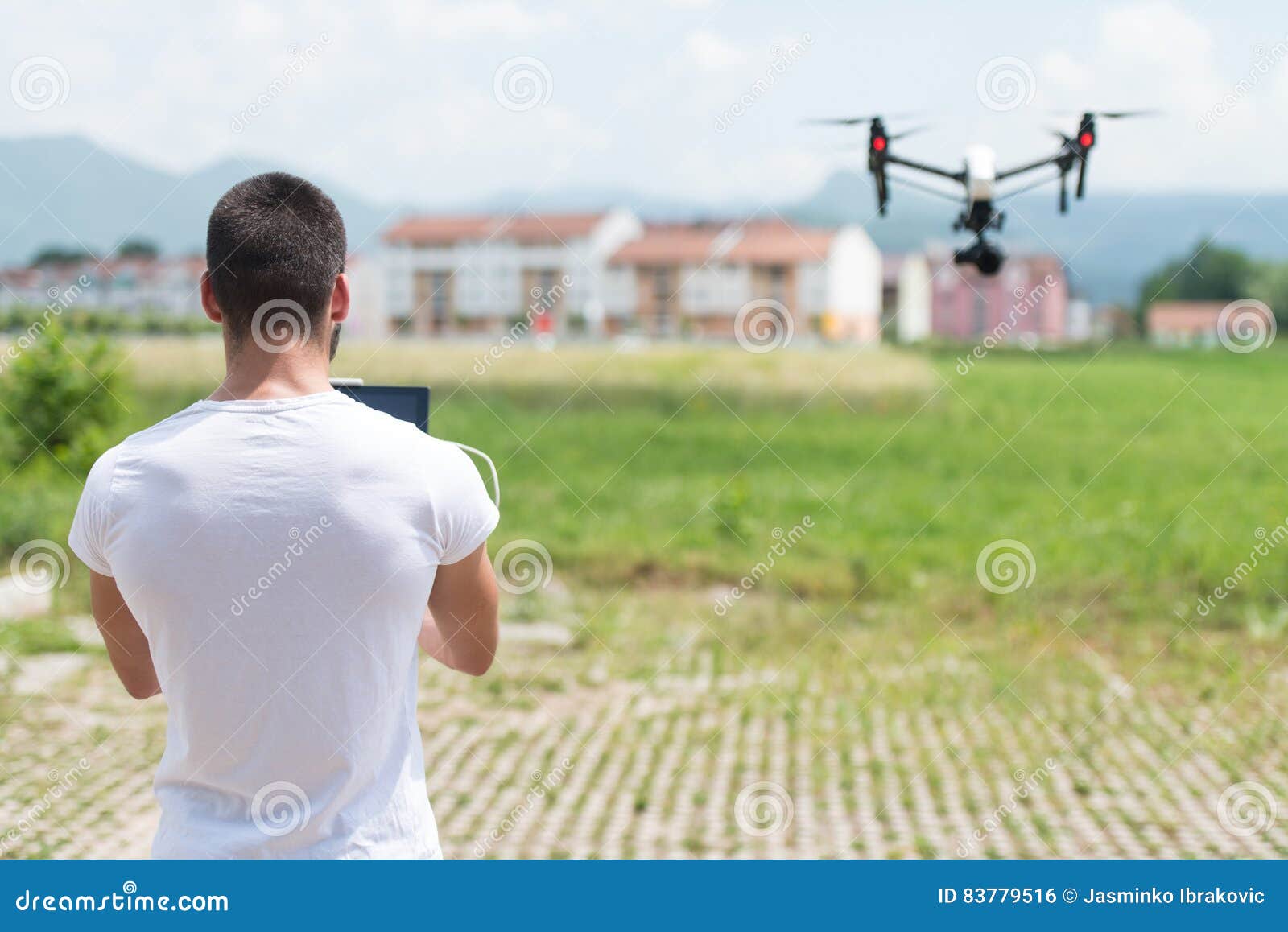 Man Operating a Flying Drone in the Sky Stock Photo - Image of playing ...
