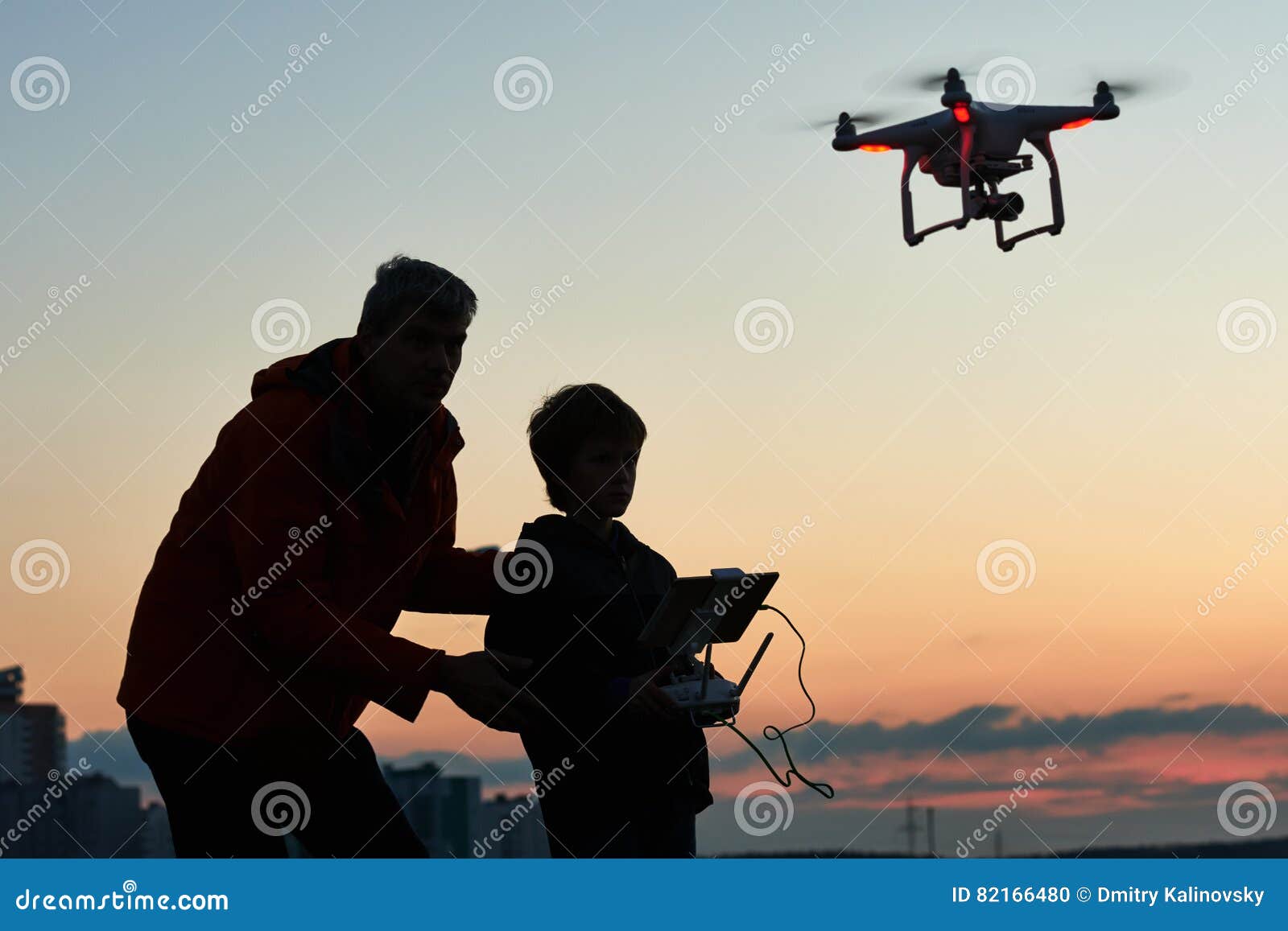 Man Operating of Flying Drone at Sunset Stock Photo - Image of ...