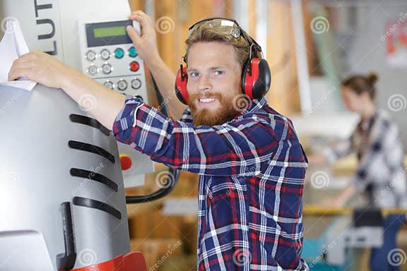 Man operating machine stock image. Image of machine - 266081763