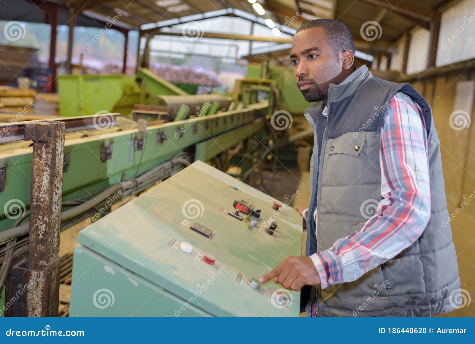 Man Operating Machine at Factory Stock Photo - Image of industry ...