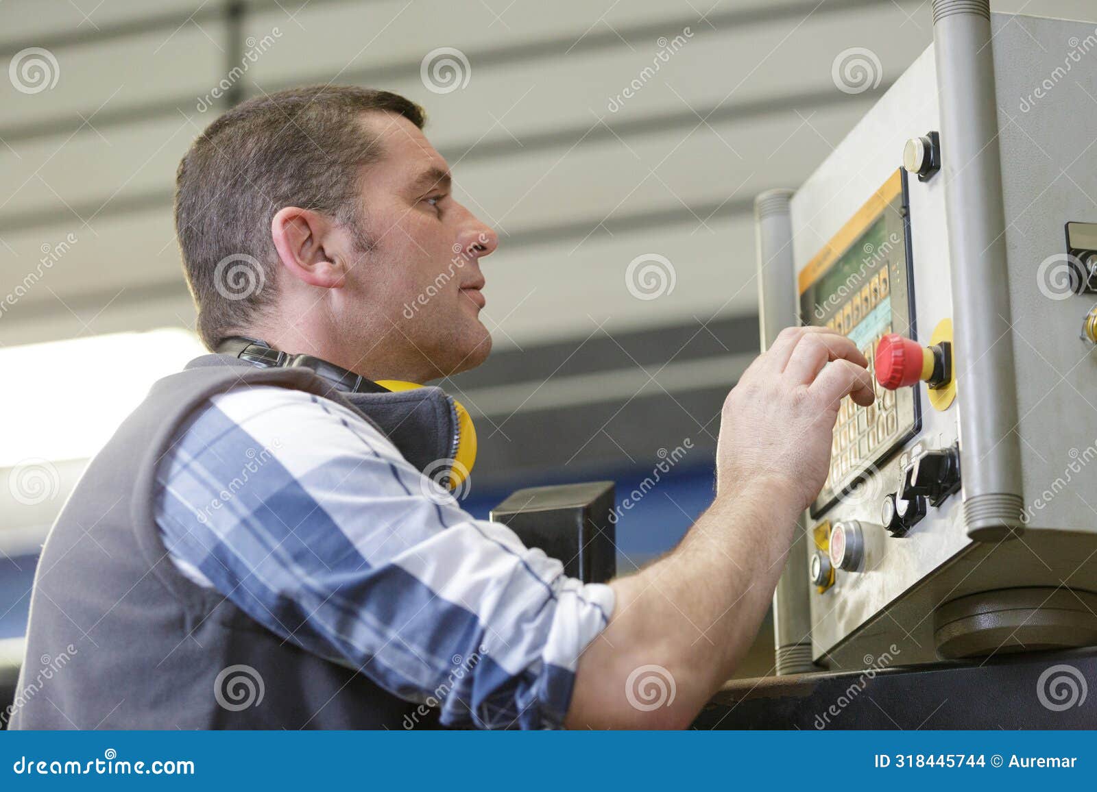 Man Operating Machine in Factory Stock Photo - Image of machine ...