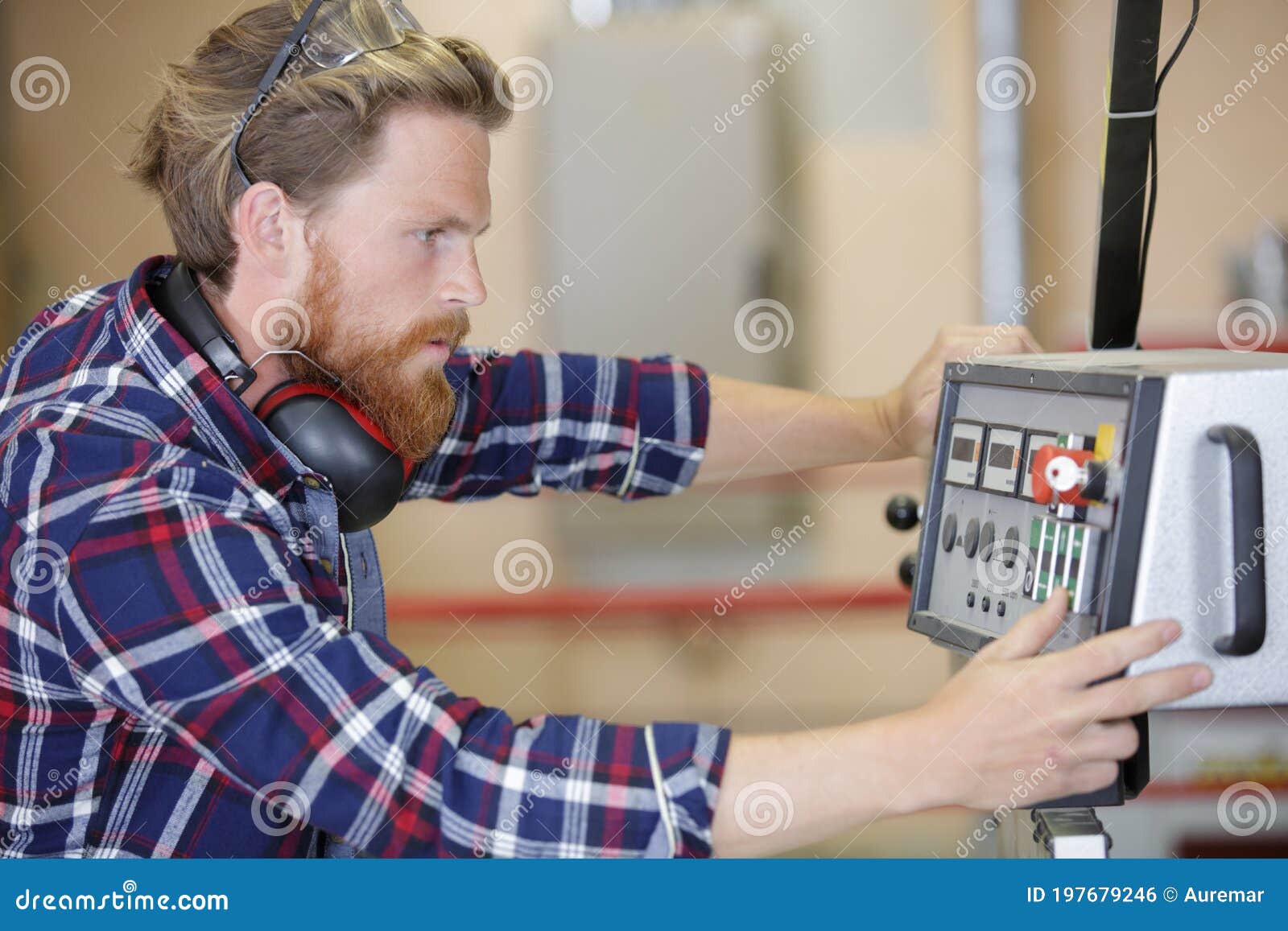Man operating machine stock photo. Image of manufacturer - 197679246
