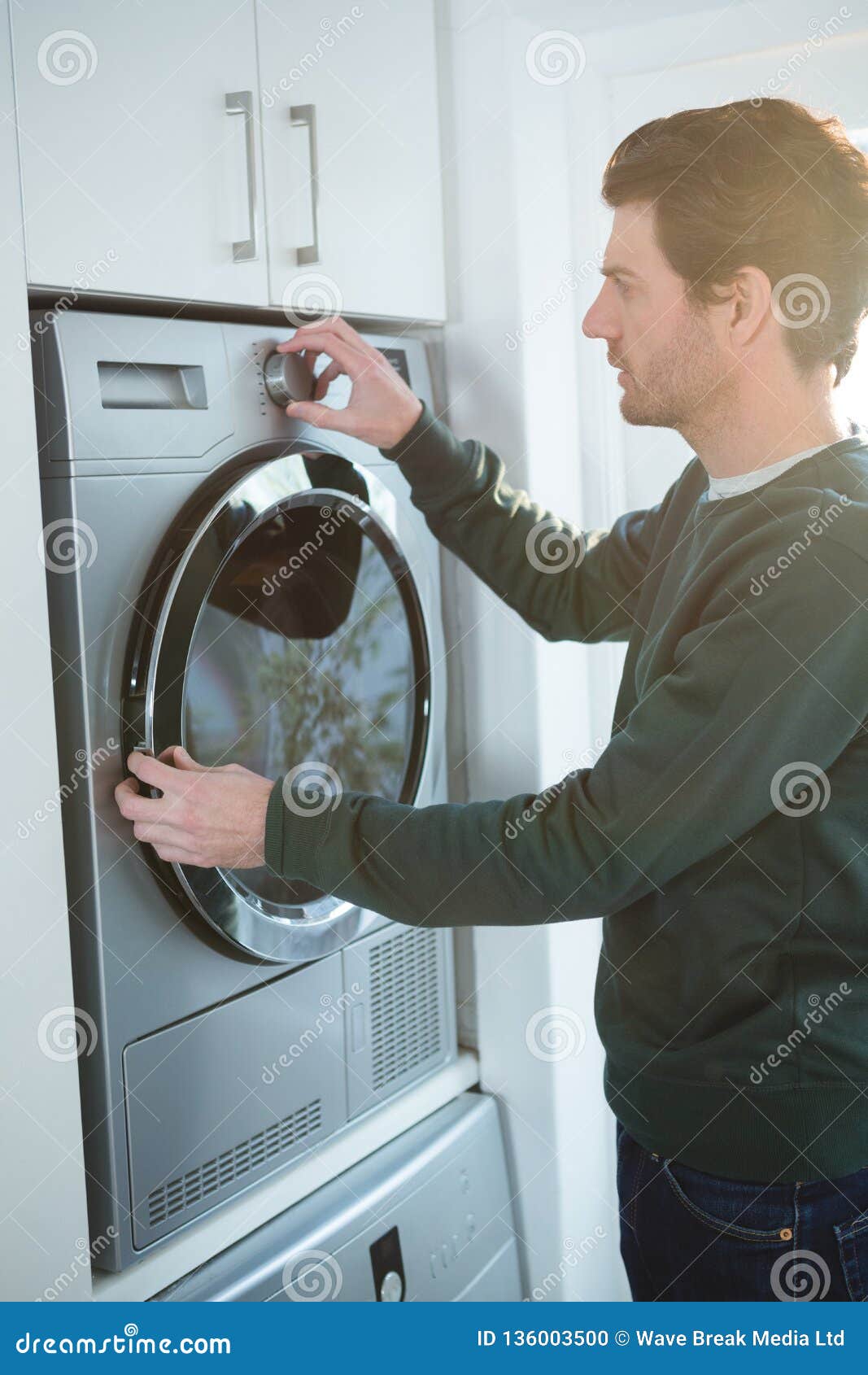 Man Operating Washing Machine Stock Photo - Image of home, appliance ...