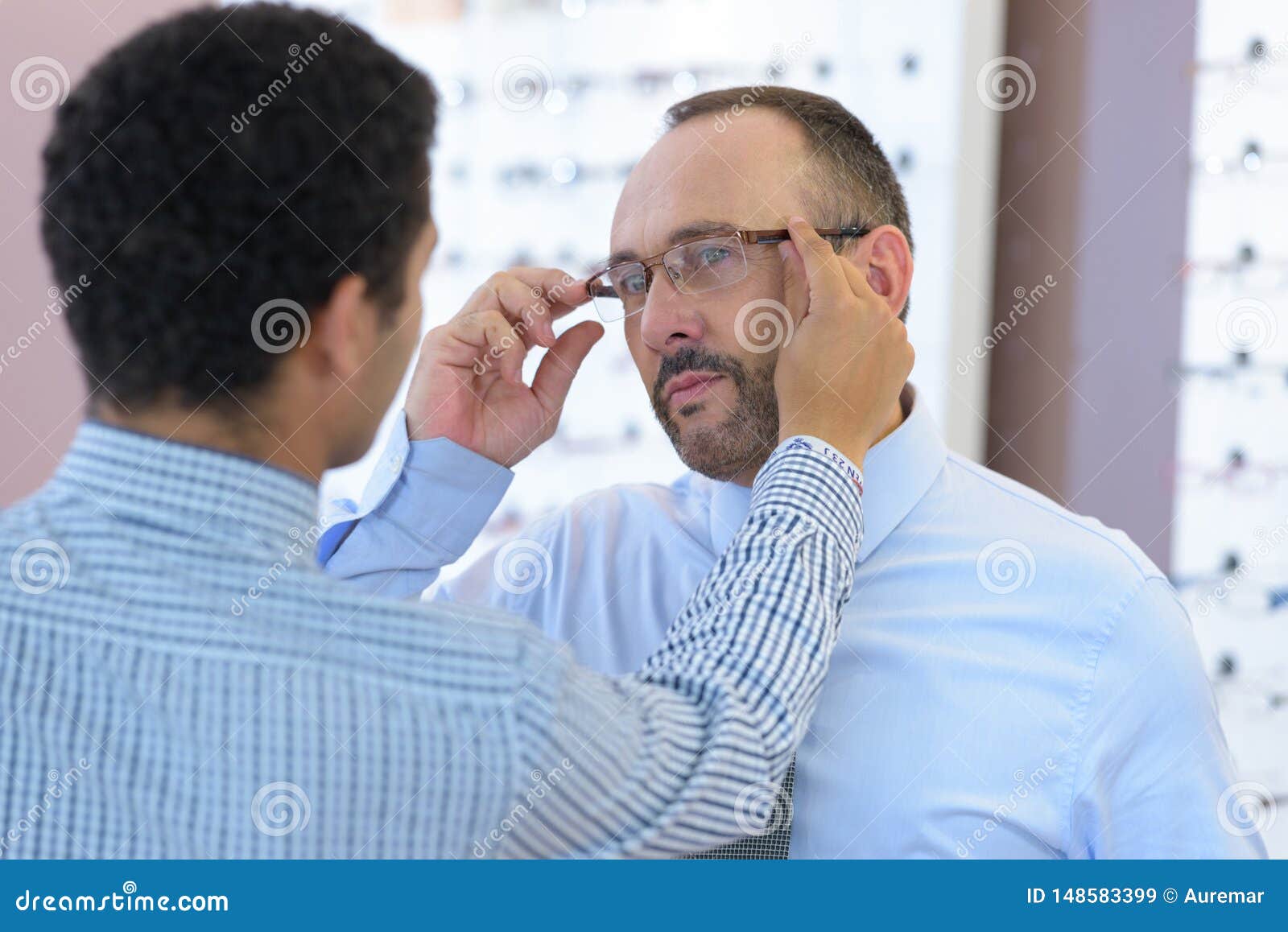 Man in optics store stock image. Image of optic, correction - 148583399
