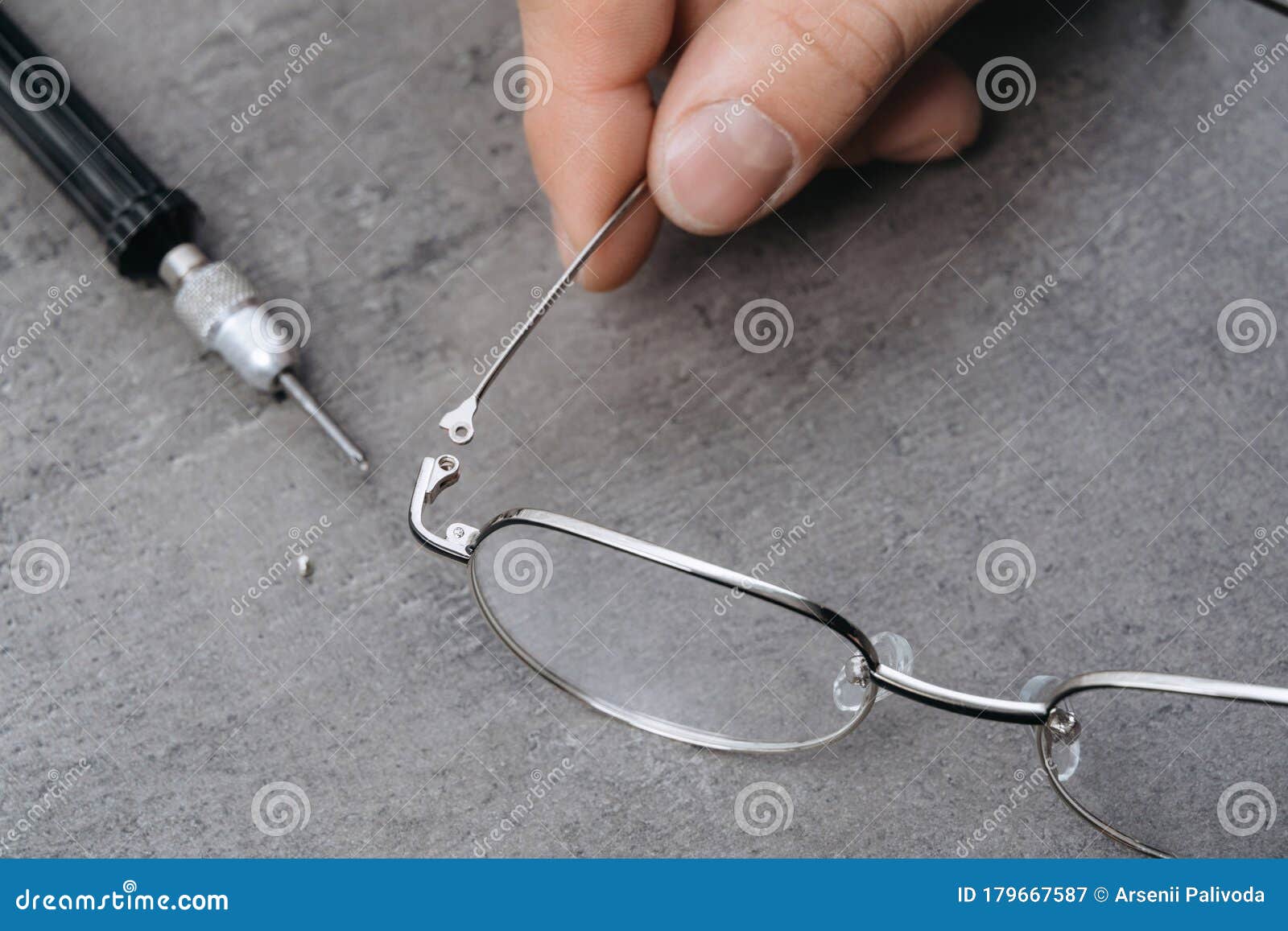 Man Optometrist is Setting Temple of Glasses Using Professional Tools ...