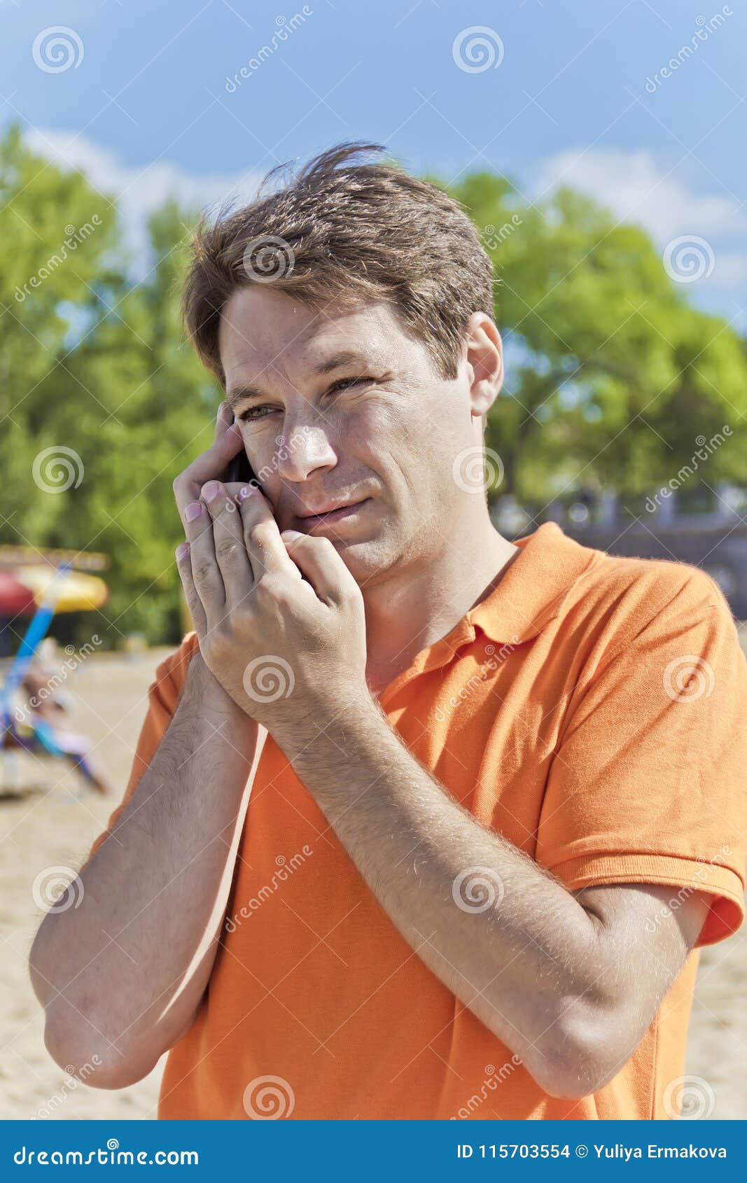 Man in orange clothes stock photo. Image of talking - 115703554