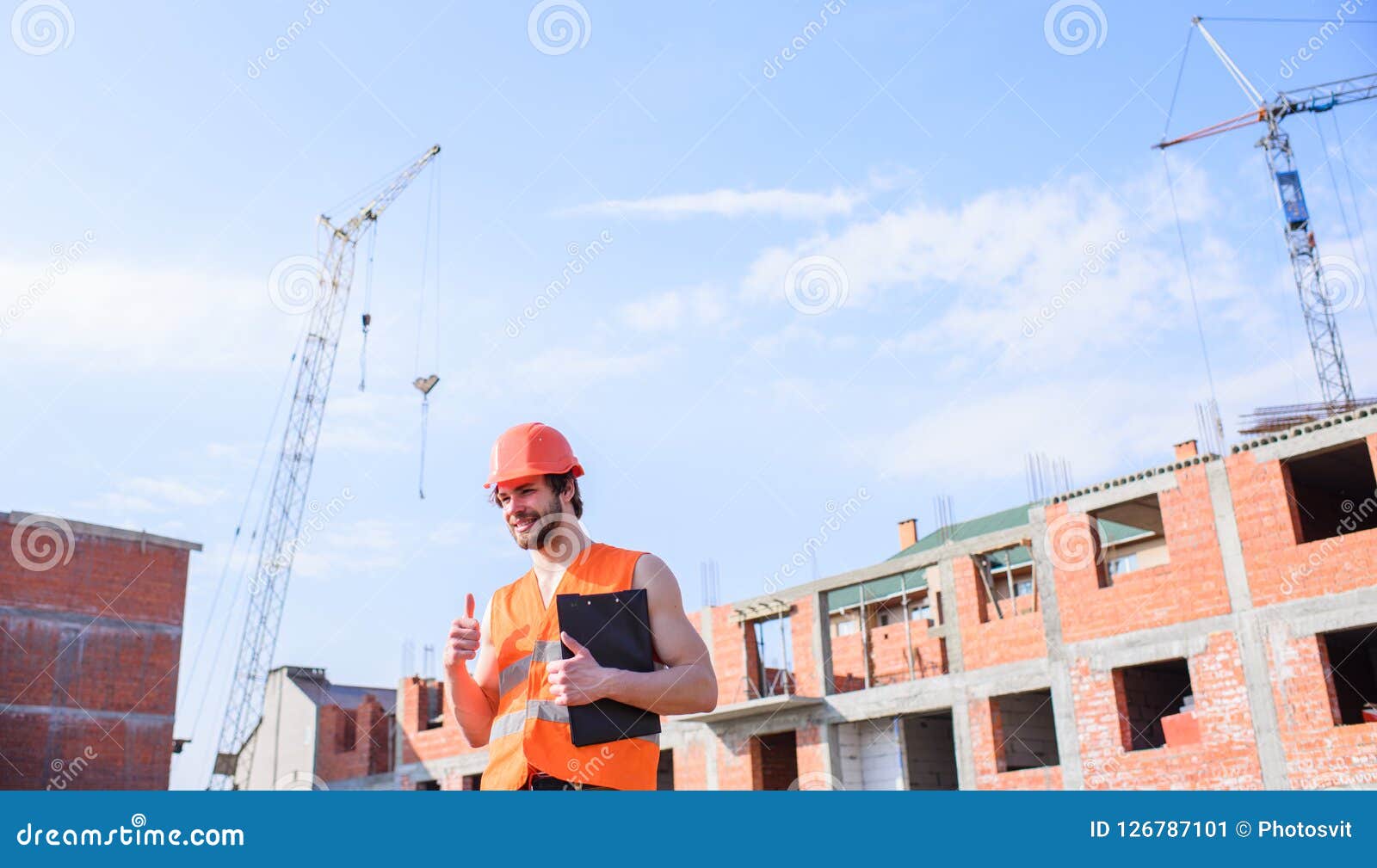 Man Orange Vest and Helmet Works at Construction Site. Contractor ...