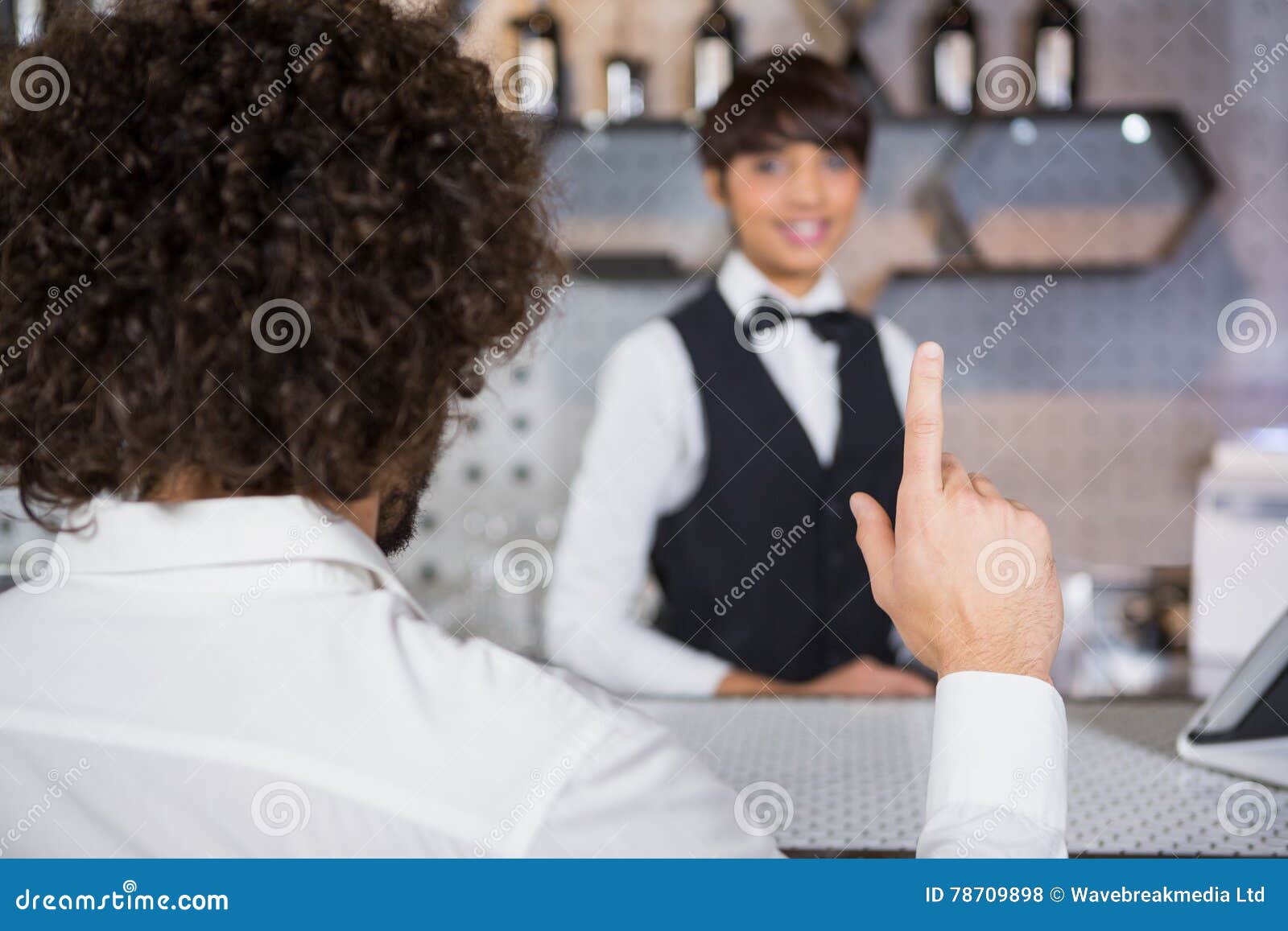 Man Ordering a Drink at Bar Counter Stock Photo - Image of indoors ...
