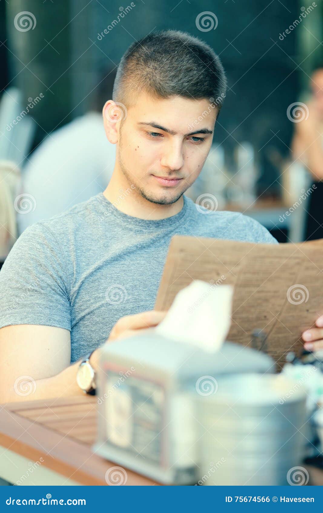 Man in Outdoor Restaurant Looking at the Menu Stock Photo - Image of ...