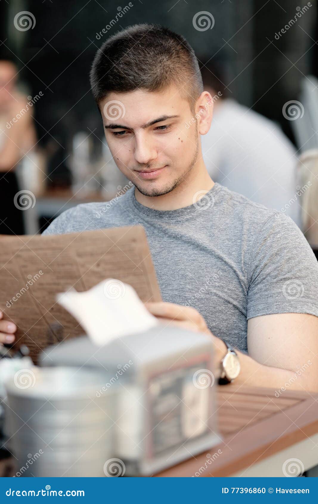 Man in Outdoor Restaurant Looking at the Menu Stock Photo - Image of ...