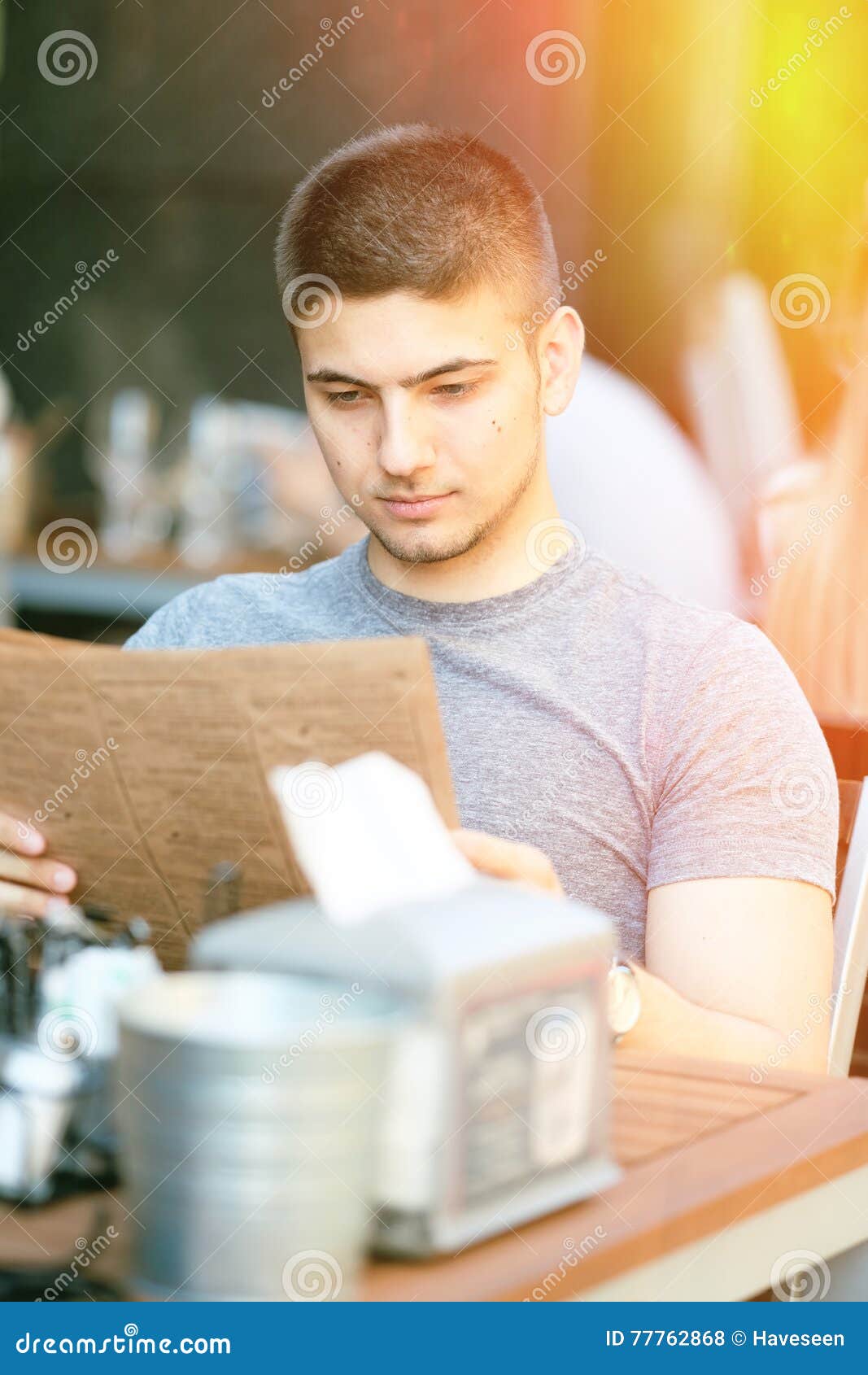 Man in Outdoor Restaurant Looking at the Menu Stock Photo - Image of ...