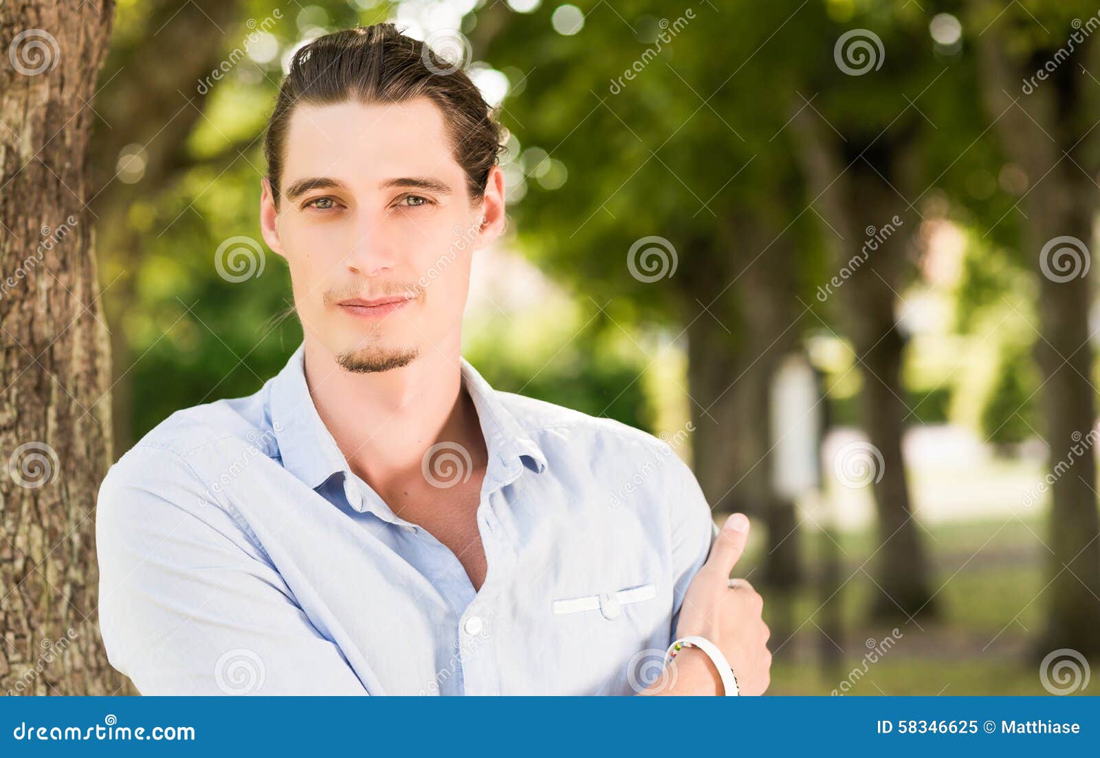 Man Outdoors Leaning on a Tree Stock Image - Image of charm, portrait ...