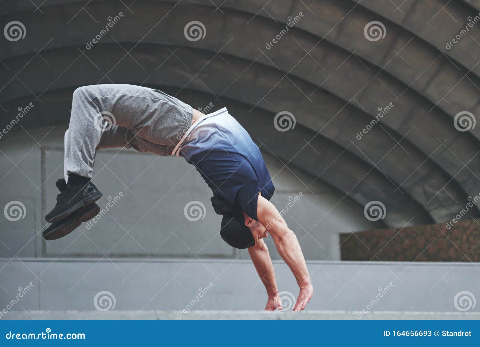 The Man Outdoors Practices Parkour, Extreme Acrobatics. Stock Image ...