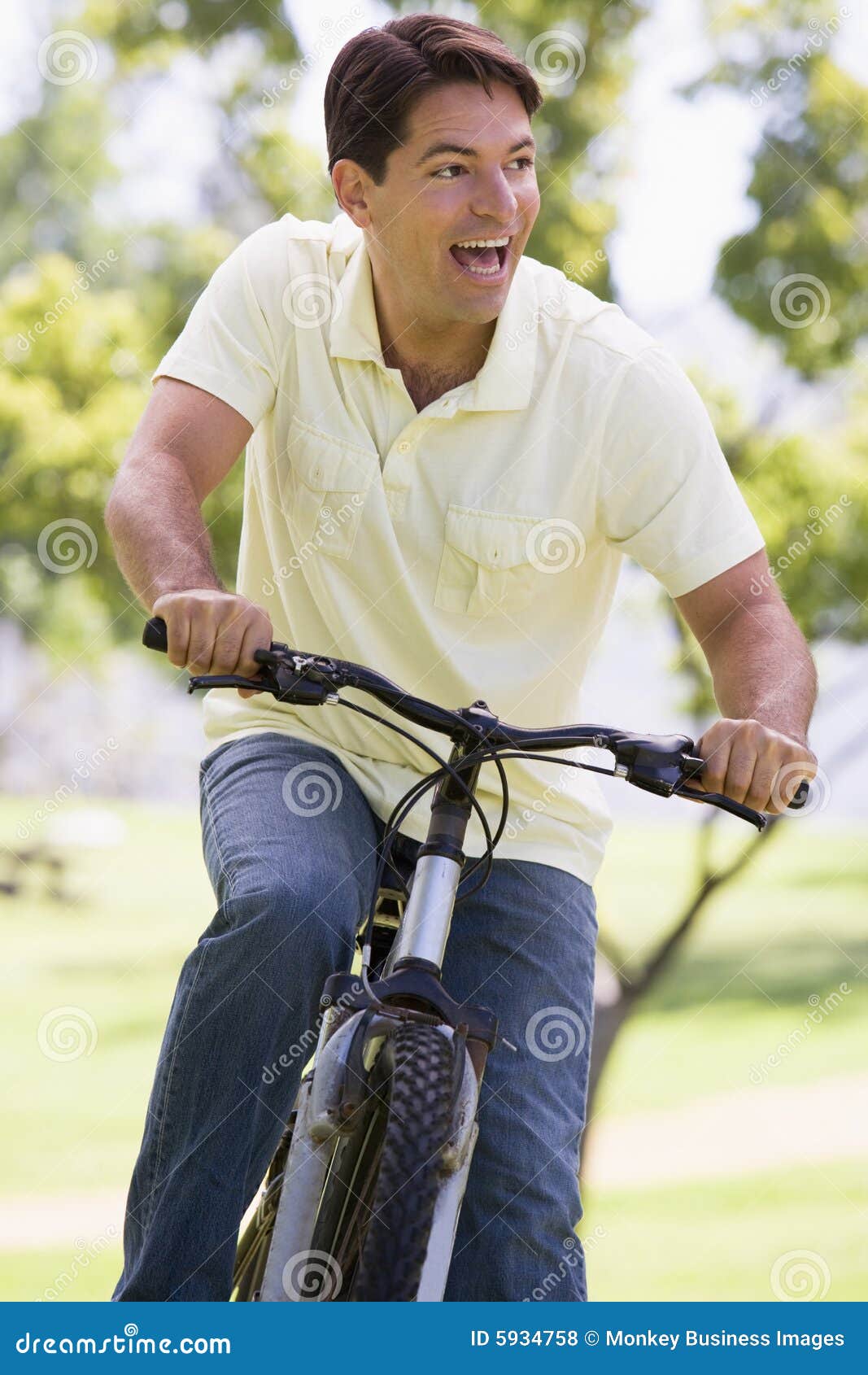 Man Outdoors Riding Bike Smiling Stock Photo - Image of person, smiling ...