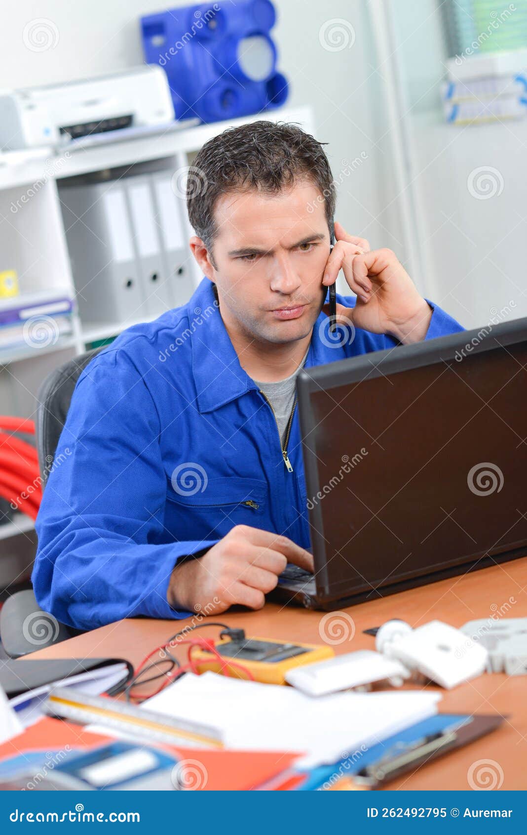 Man in Overalls on Computer Frowning Stock Image - Image of frown ...