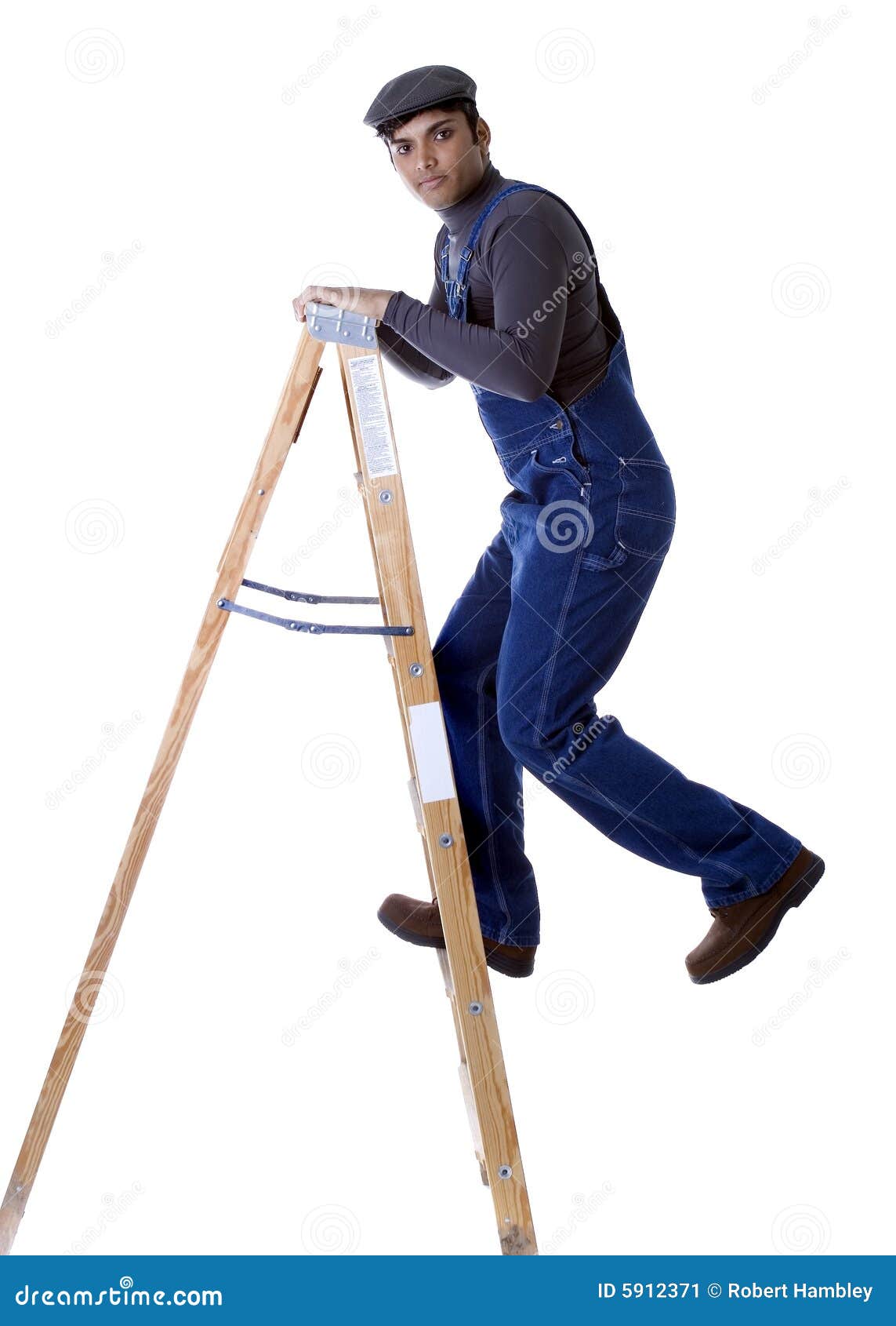 Man in Overalls on Ladder stock image. Image of denim - 5912371