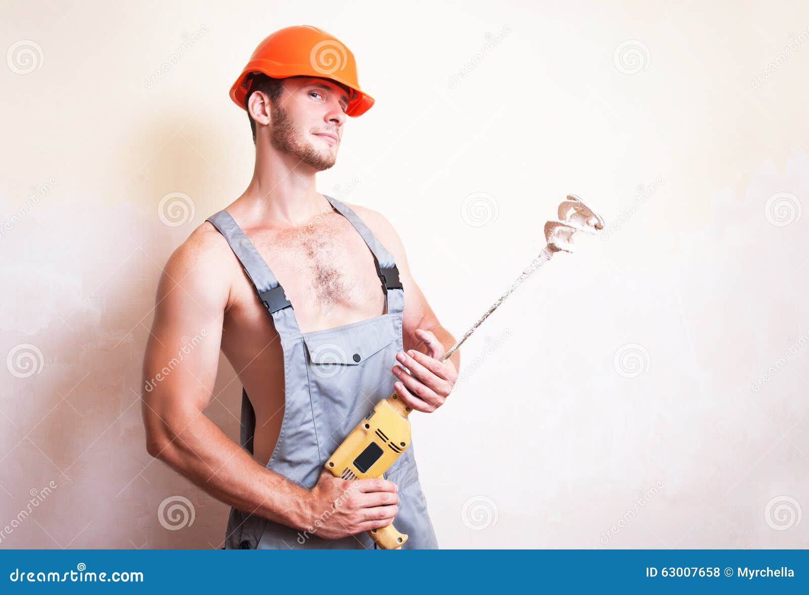 Man in Overalls with a Mixer for Plastering Stock Photo - Image of ...
