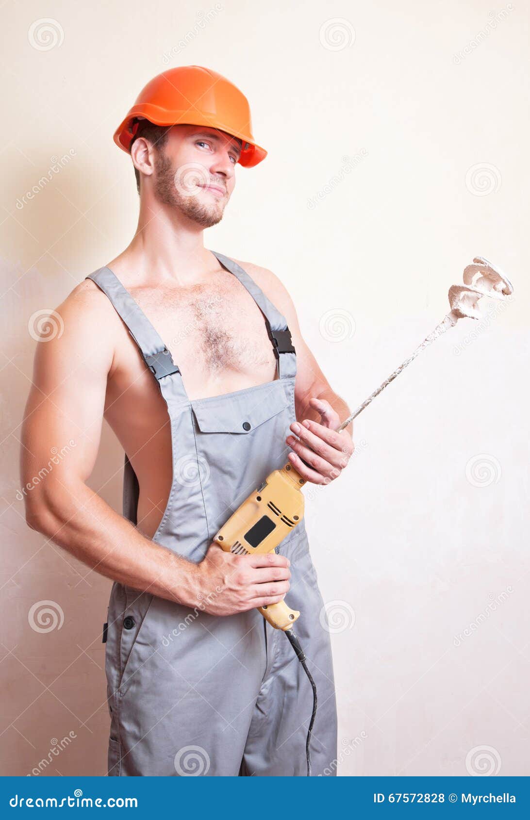 Man in Overalls with a Mixer for Plastering Stock Photo - Image of ...