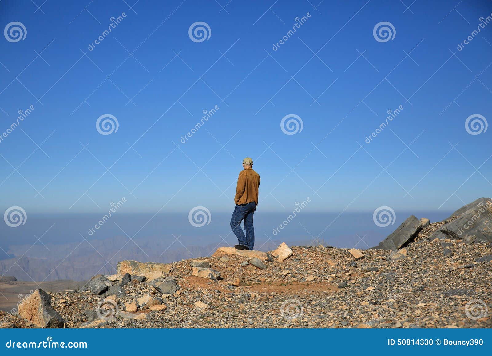 Man Overlooking the Horizon Stock Photo - Image of looking ...