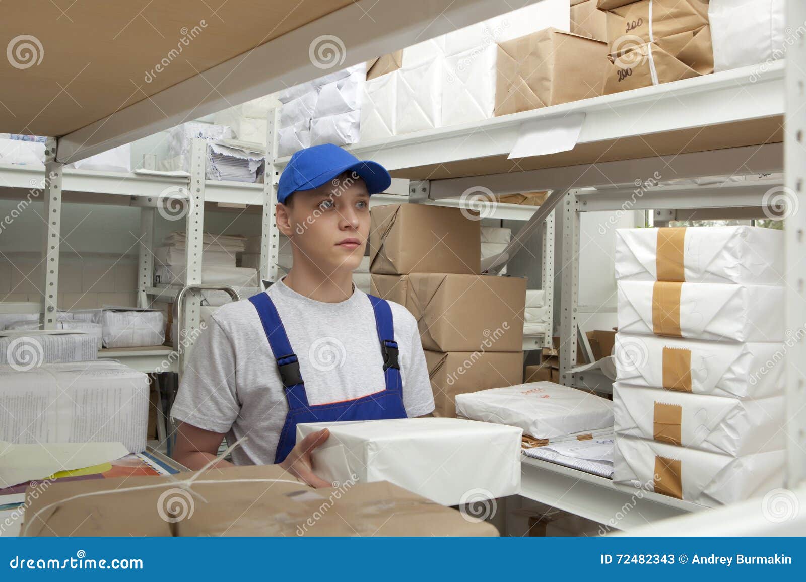 Man with Package in Uniform at Warehouse Stock Image - Image of order ...