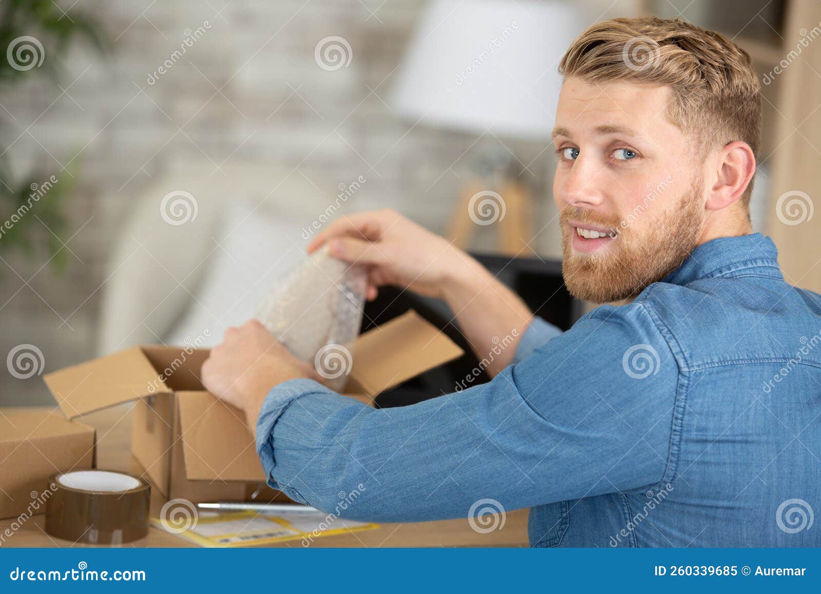 Man packing box stock image. Image of retail, unpacking - 260339685