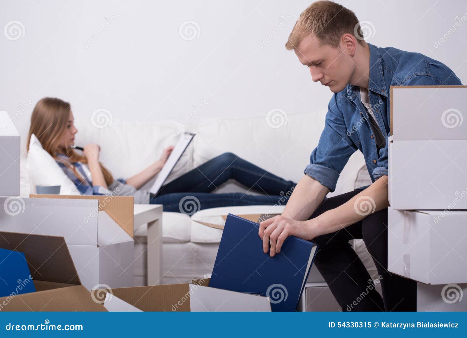 Man packing boxes stock image. Image of moving, flat - 54330315