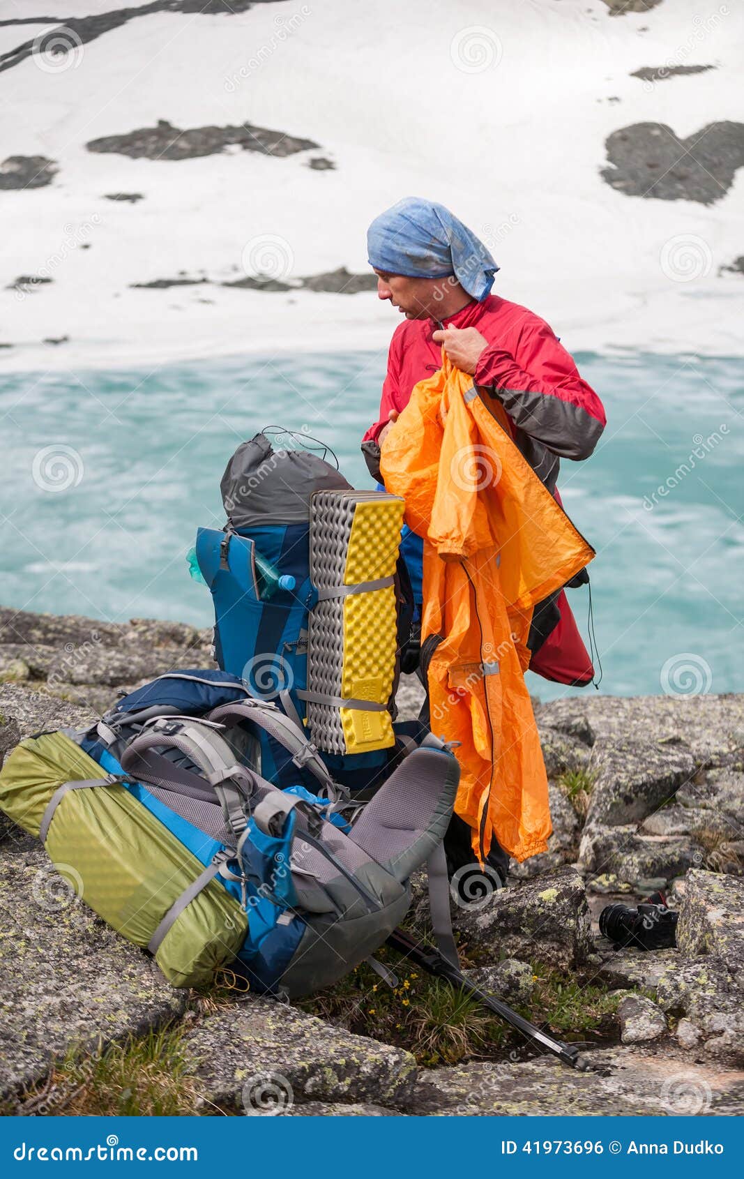 Man is Packing His Backpack Whike Hiking Stock Photo - Image of ...