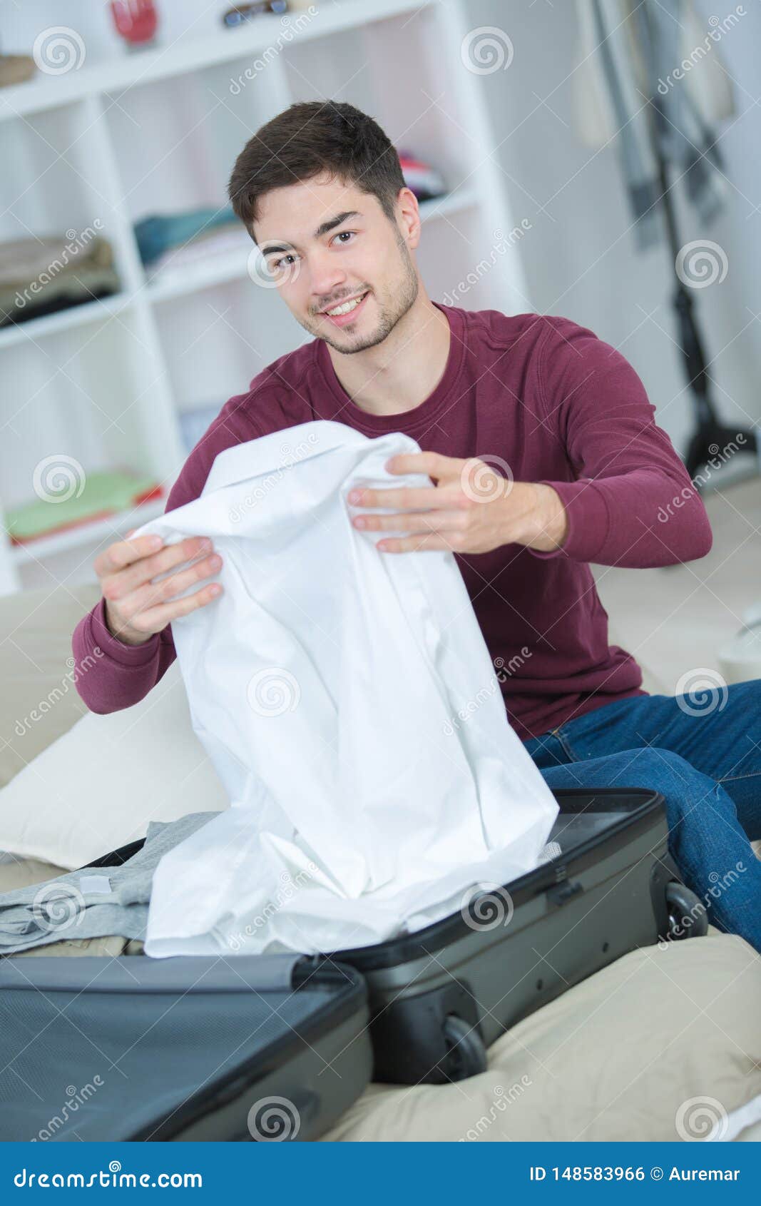 Man Packing Clothes and Putting in Suitcase Stock Photo - Image of ...