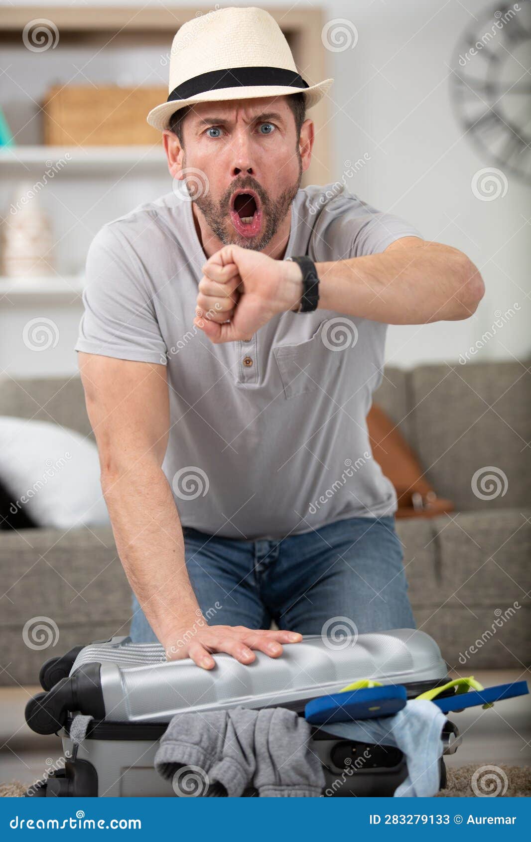 Man Packing Suitcase Looks at Watch in Panic Stock Image - Image of ...