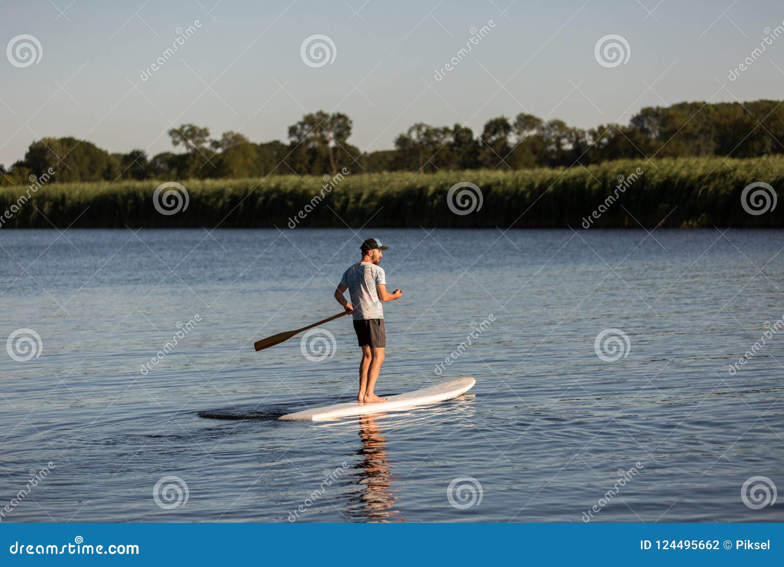 Man on a Paddle Board stock photo. Image of ride, paddleboard - 124495662
