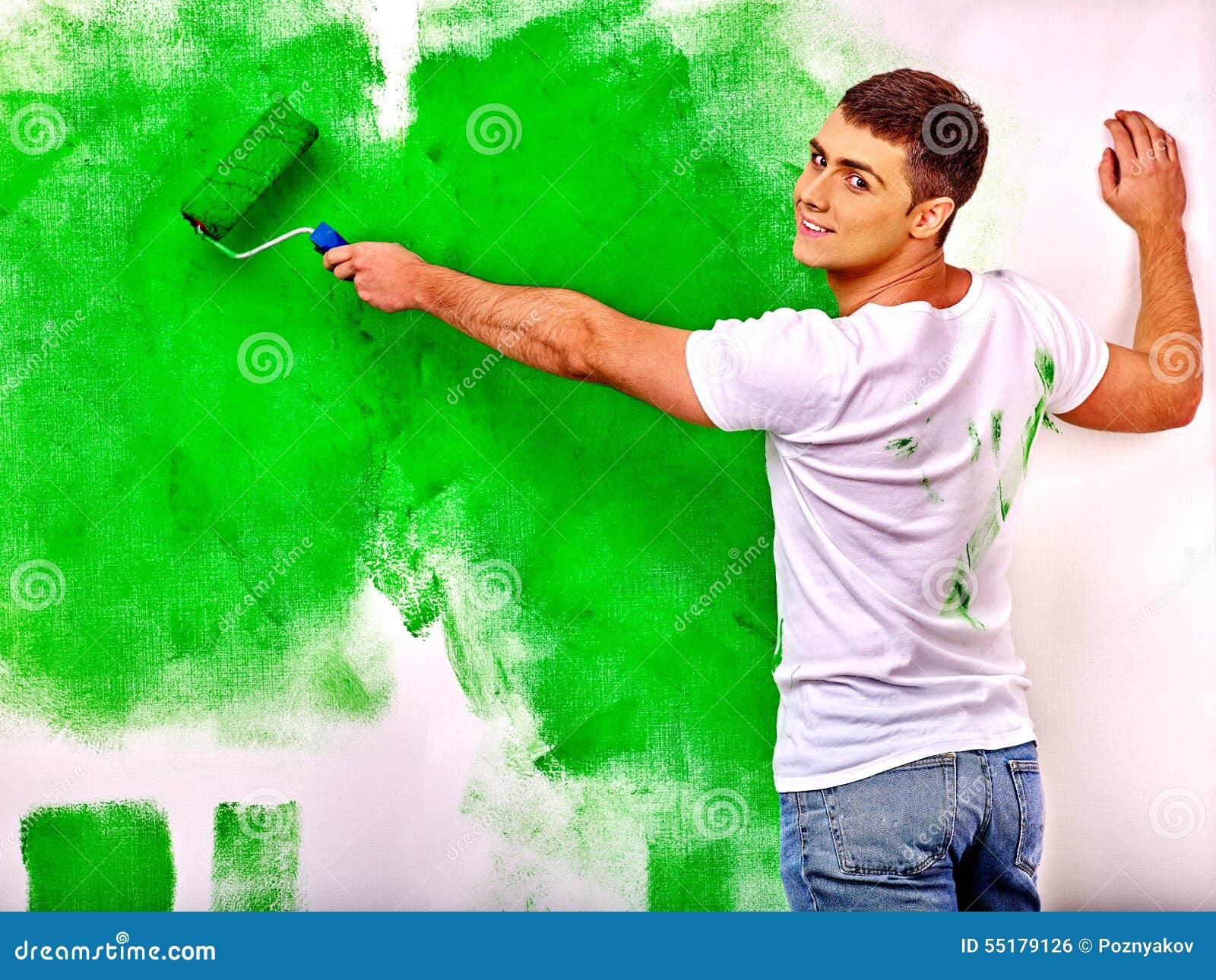 Man paint wall at home stock photo. Image of builder - 55179126