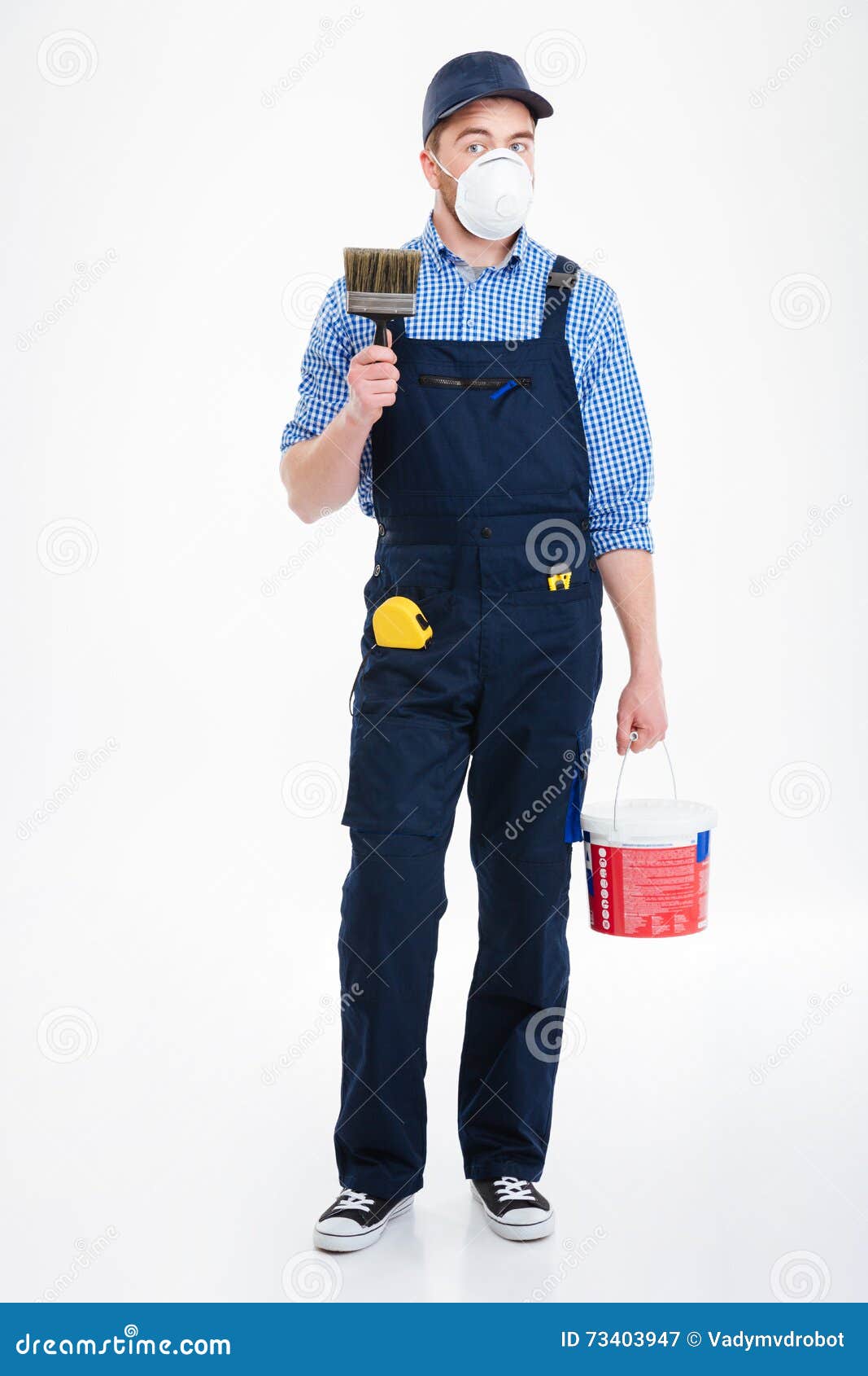 Man Painter in Protective Mask Holding Paint Bucket and Brush Stock ...