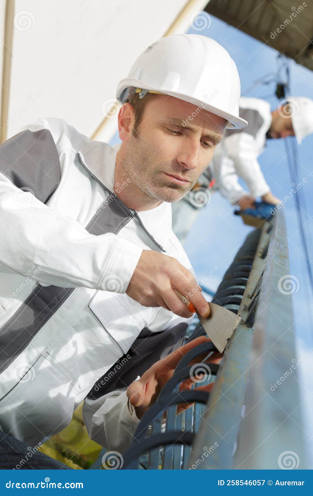 Man painting handrails stock image. Image of paint, plasterer - 258546057