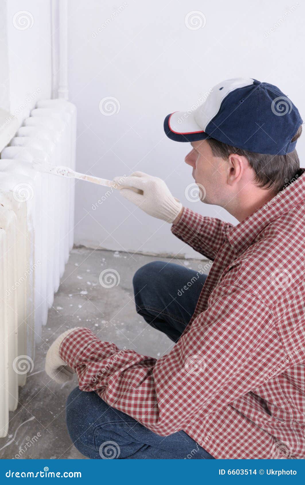 Man painting radiator stock photo. Image of room, home - 6603514