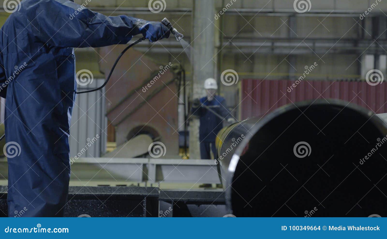Man Paints Pipe Atomizer. Mens Hand Paint the Pipes on the Plant ...