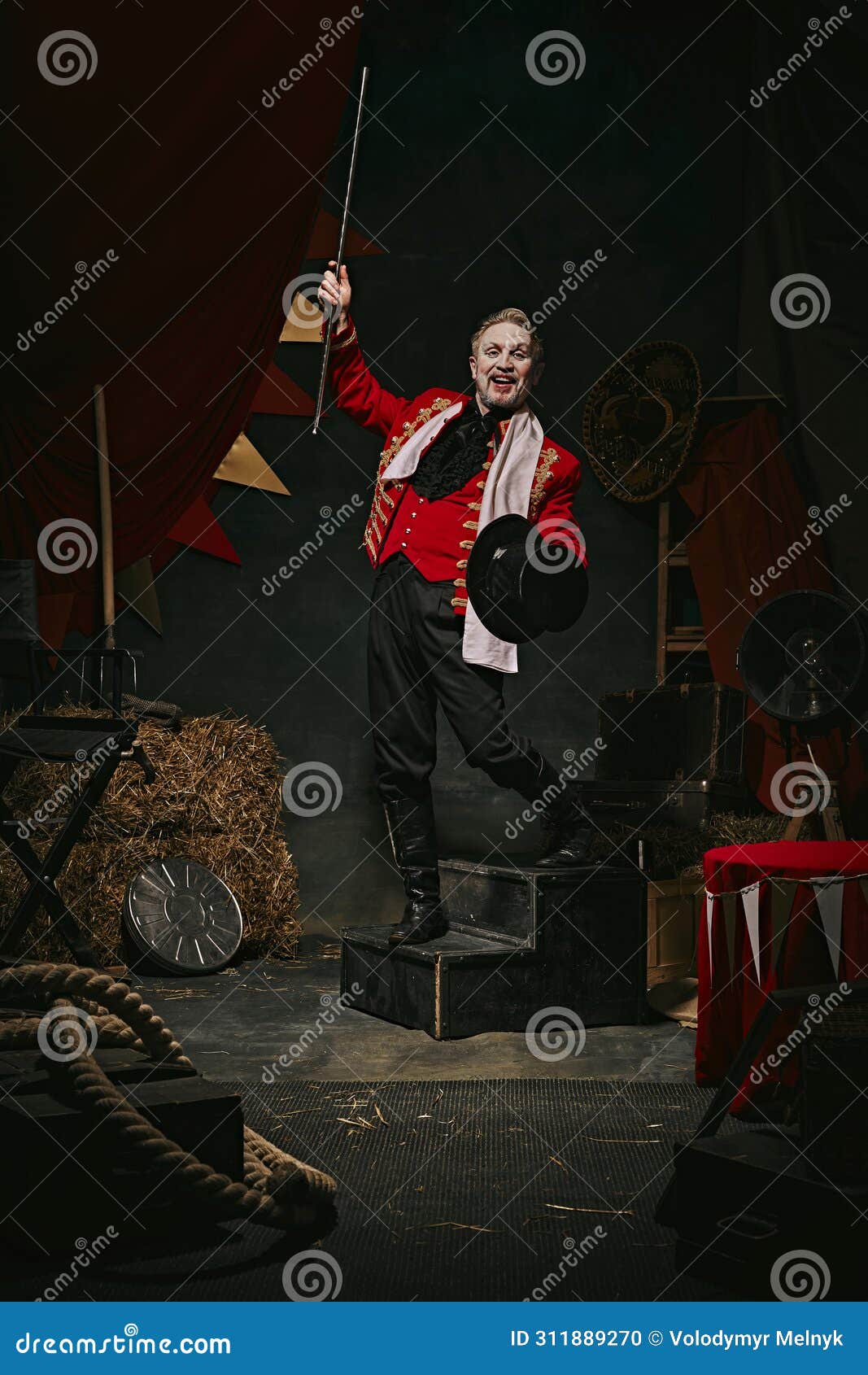 Man with Pale Face Makeup, in Red Stage Costume and Hat Making Creative ...