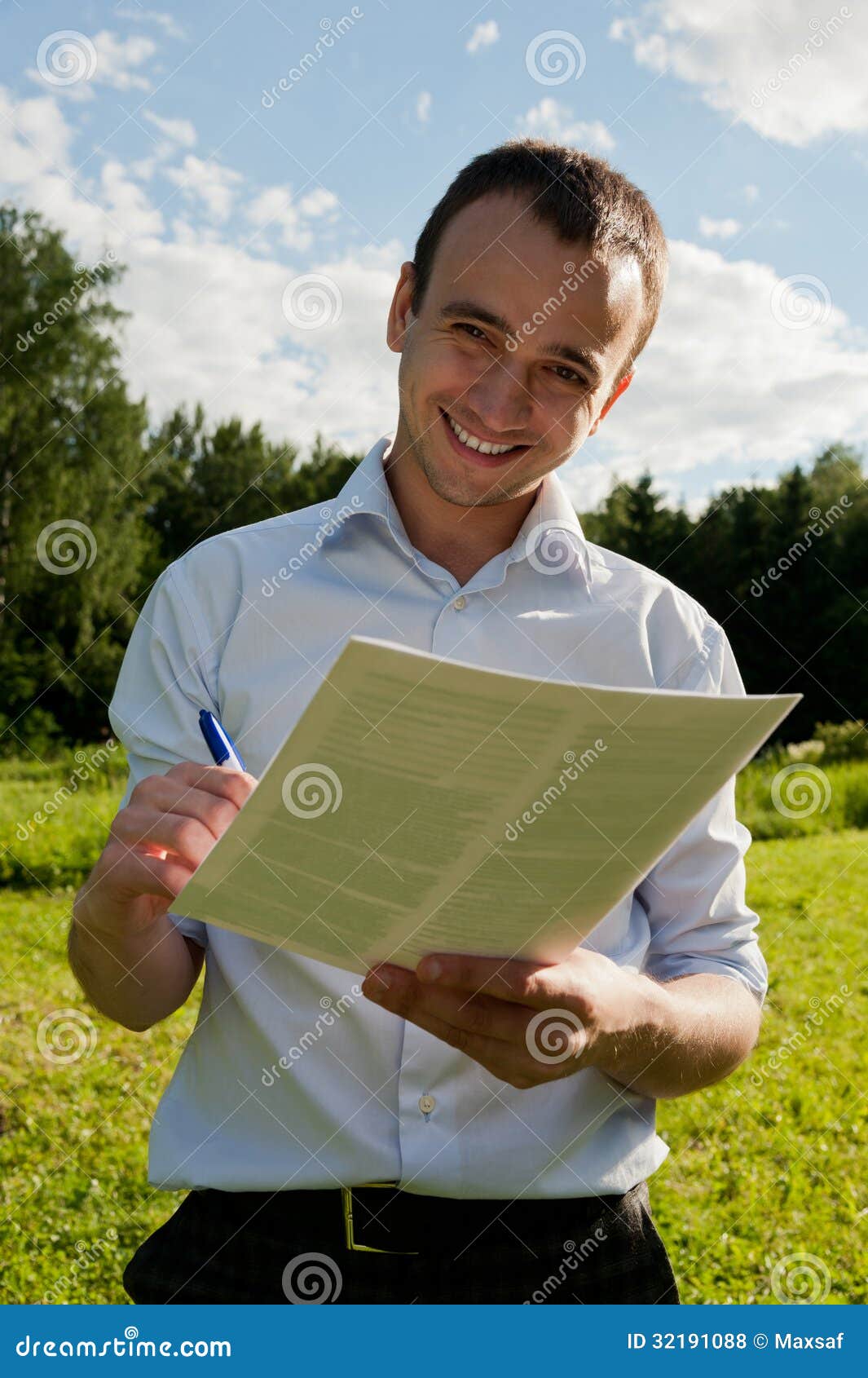 Man with Paper and Pen in the Park Stock Photo - Image of garden, paper ...