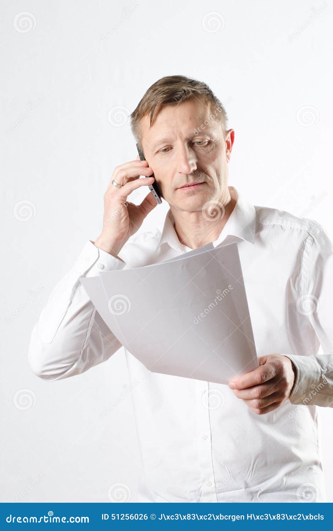 Man with Papers on the Phone Stock Photo - Image of paper, telephone ...