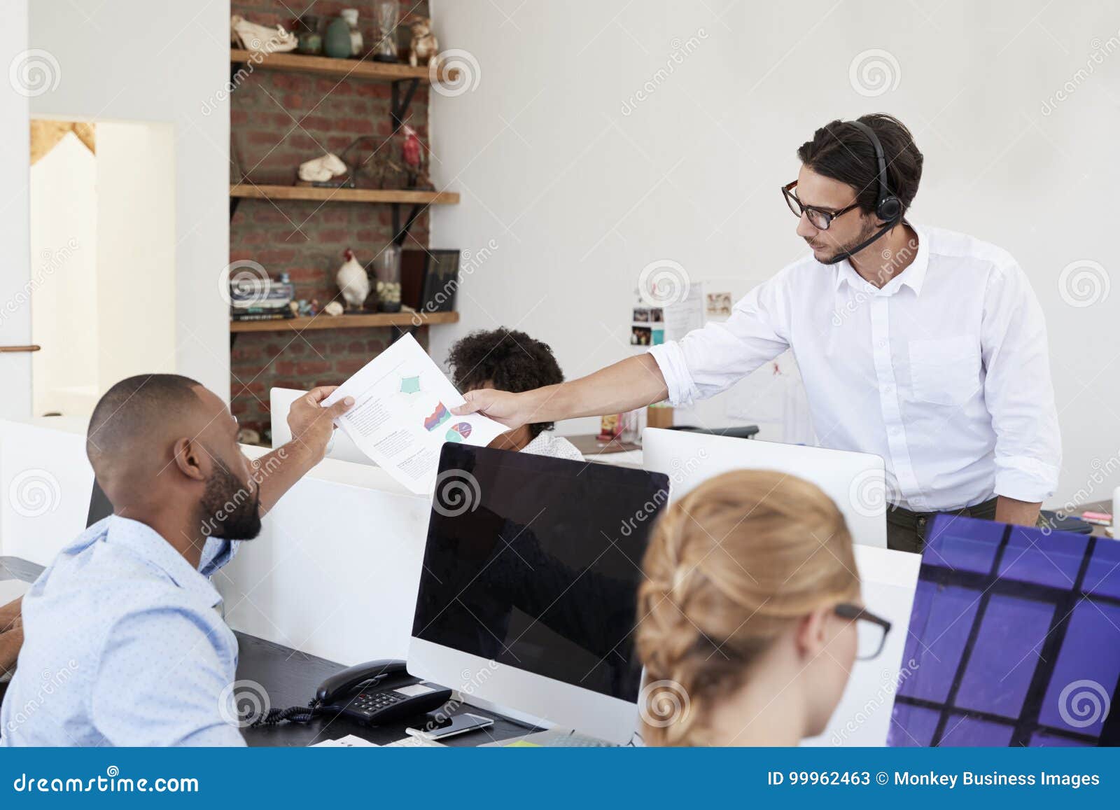 Man Passing Document in Busy Open Plan Office, Close Up Stock Image ...