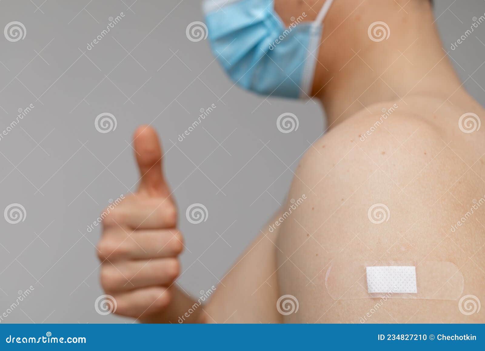 Man with Patch on the Shoulder Showing Thumbs Up Stock Photo - Image of ...