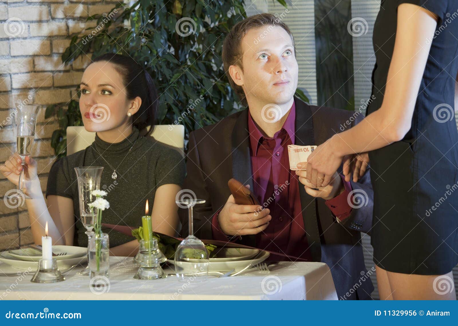 Man Paying Bill in Restaurant Stock Photo - Image of drinking, women ...
