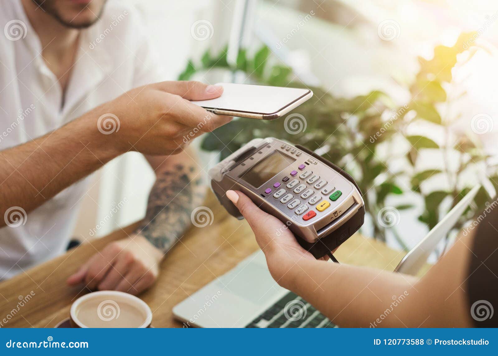 Man Paying Bill through Smartphone Using NFC Technology Stock Photo ...