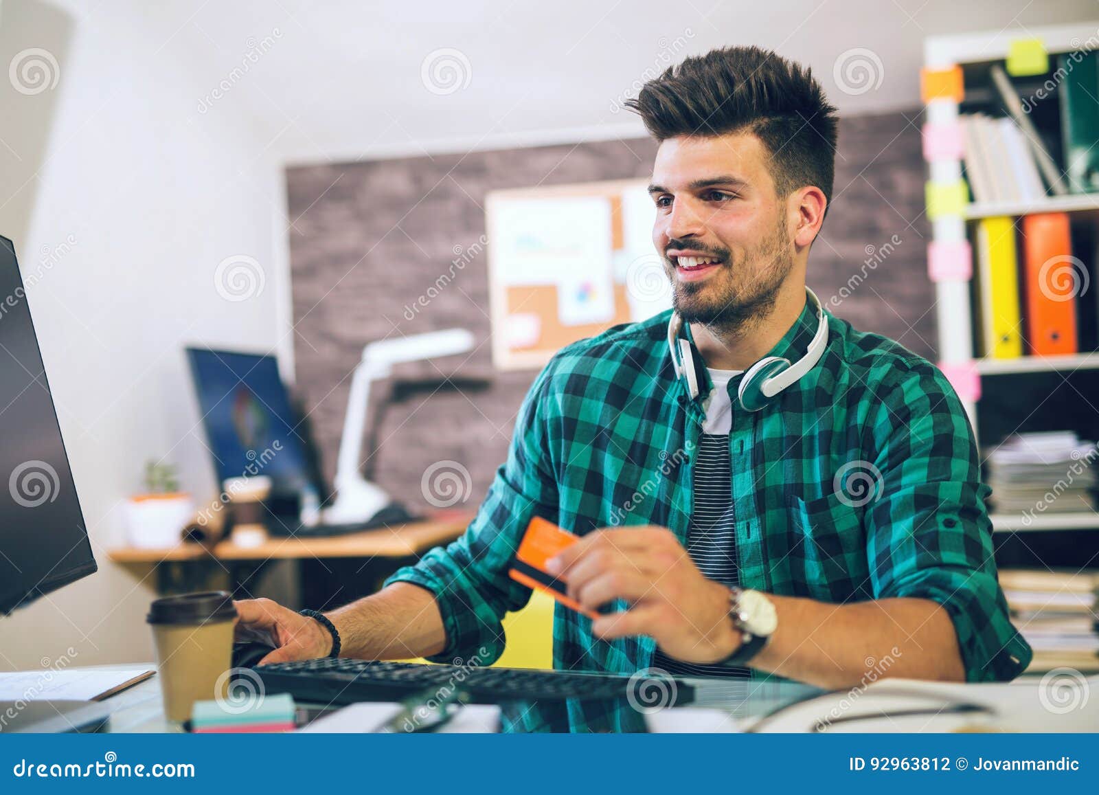 Man Paying with Credit Card on Computer at Office Stock Photo - Image ...